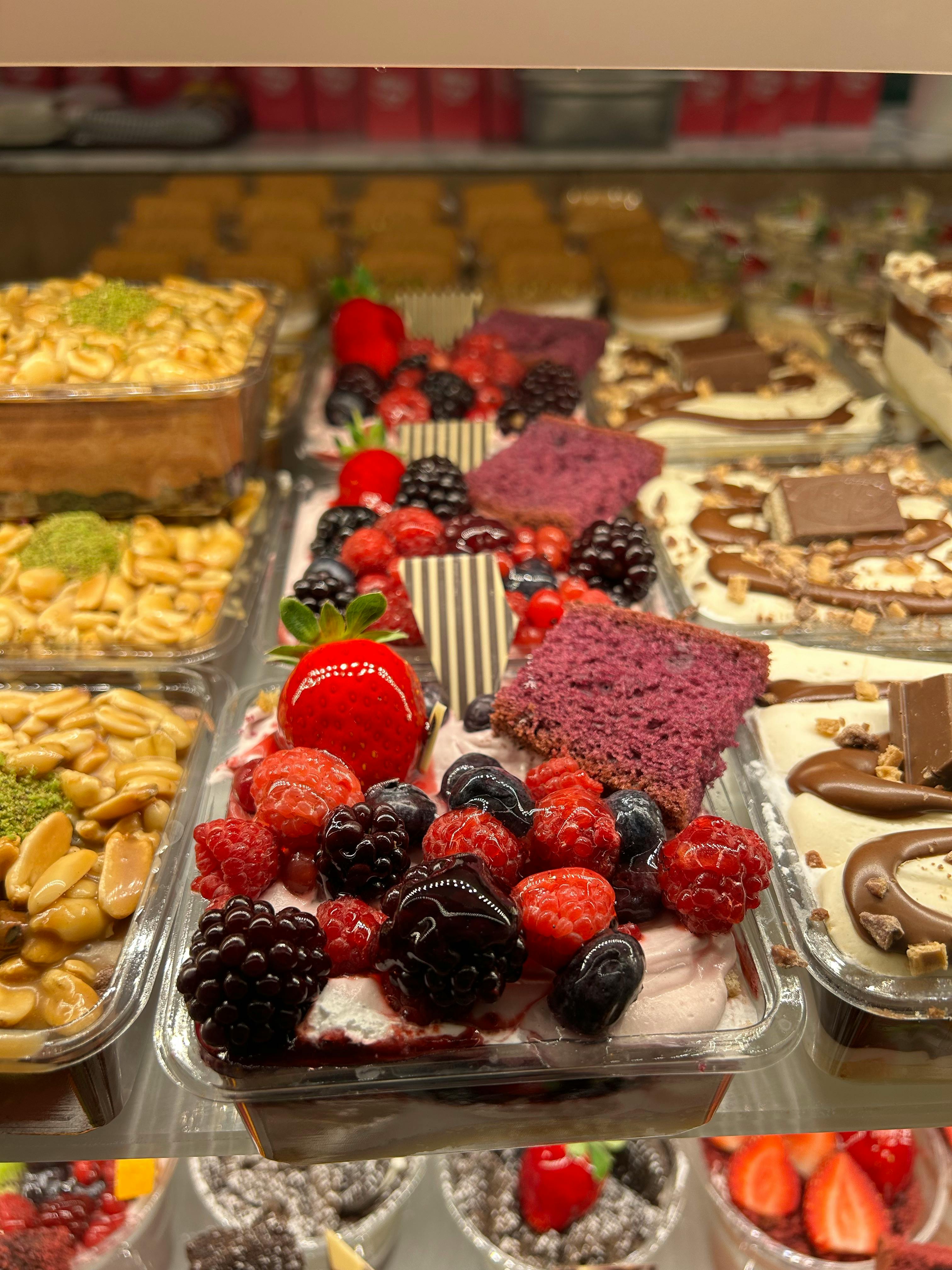 Pudding Desserts with Fruits in Confectionery Display Cabinet · Free ...