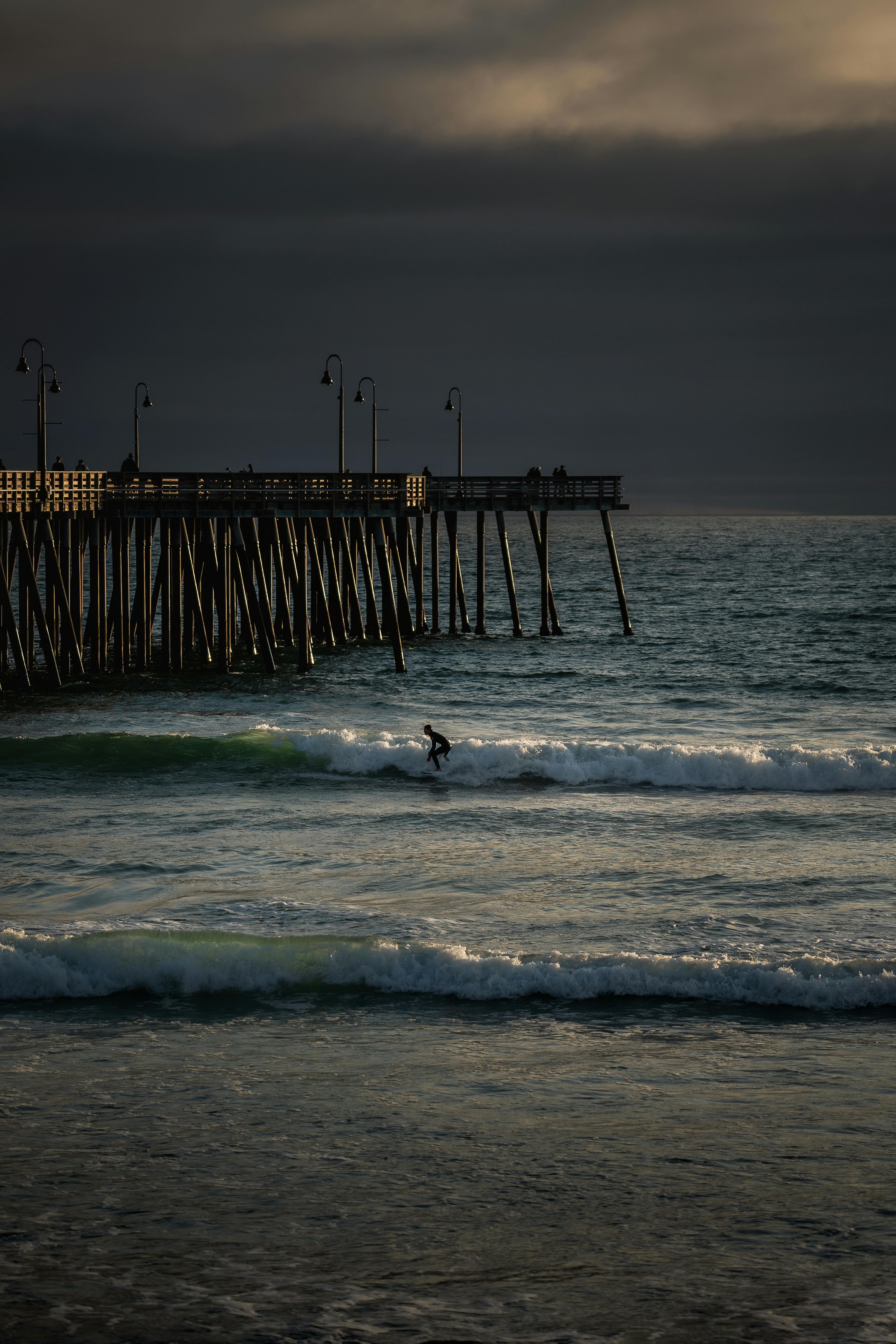 Surfer on Waves on Sea Shore · Free Stock Photo