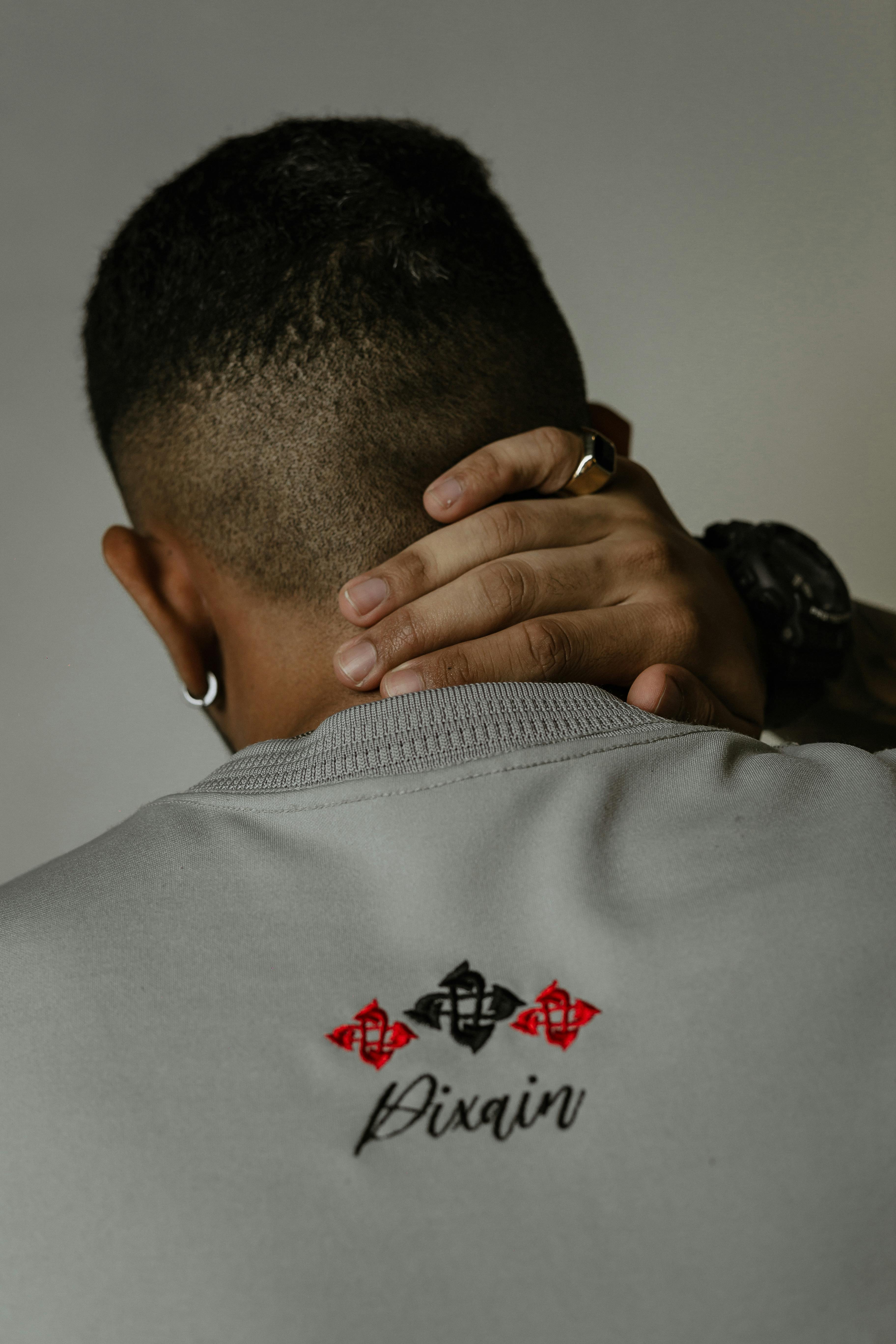 Back View of Man Wearing Gray Sweatshirt · Free Stock Photo