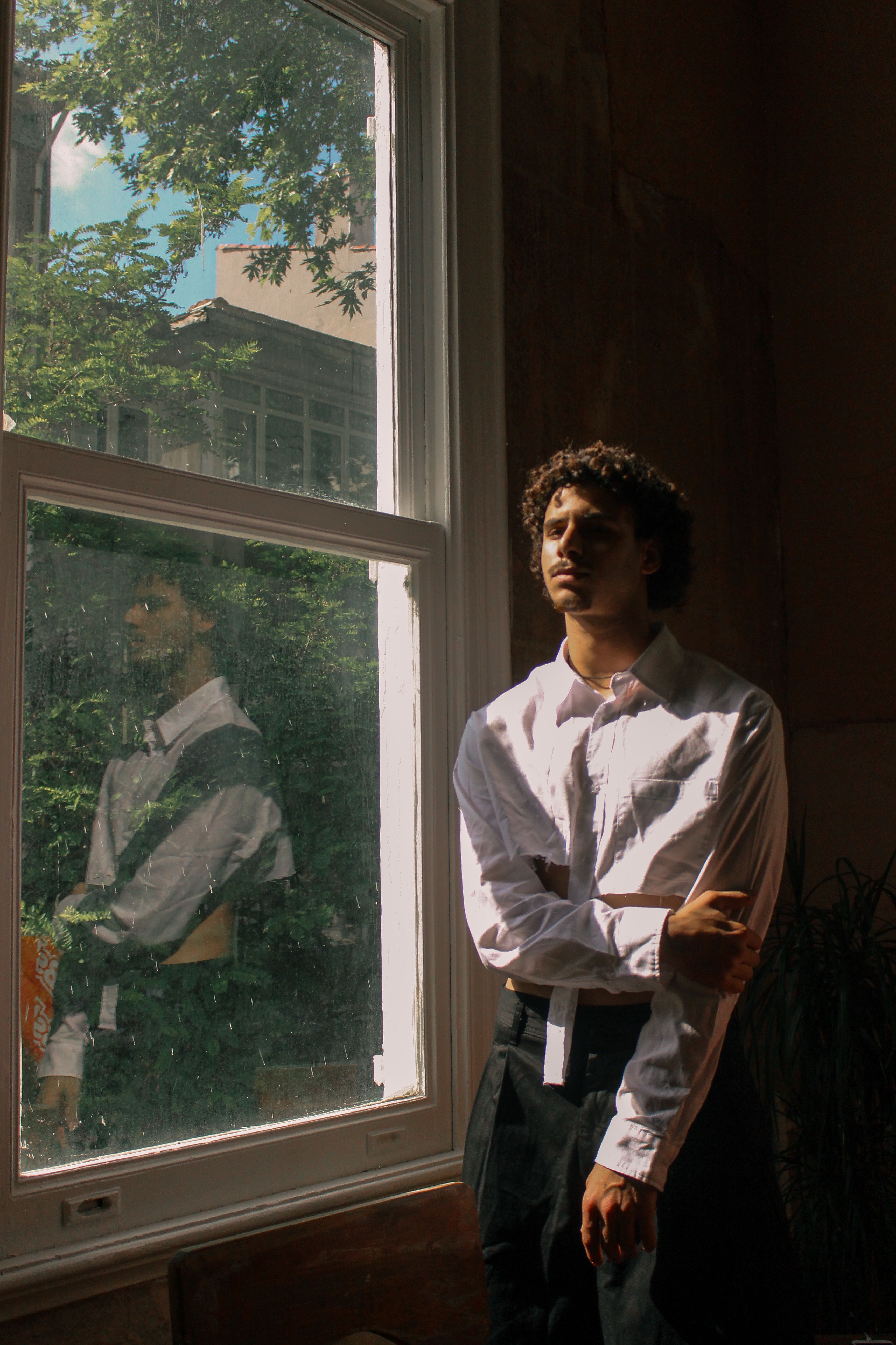 Man Next to a Window · Free Stock Photo