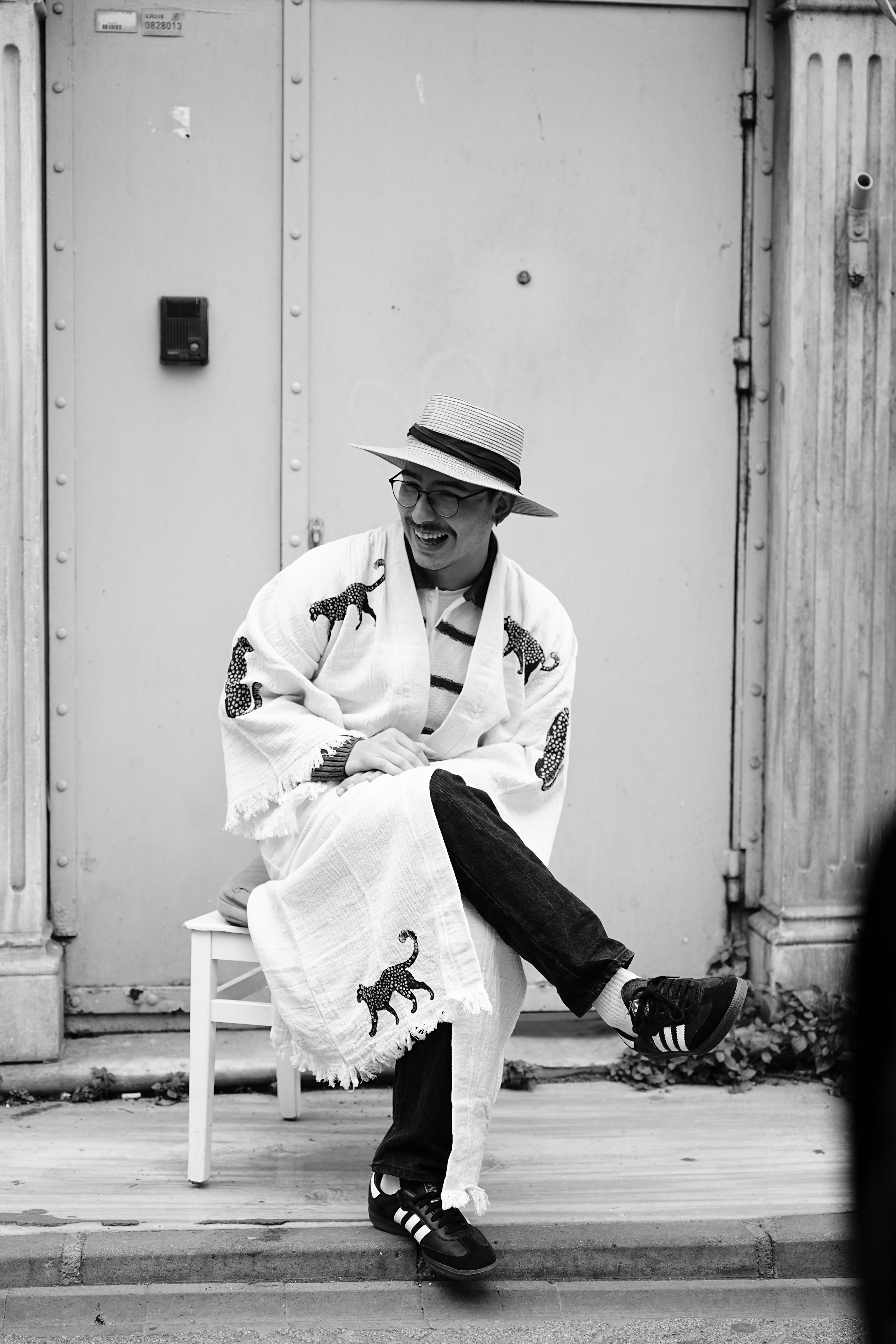 Man Sitting in Hat and Traditional Clothing and Laughing · Free Stock Photo