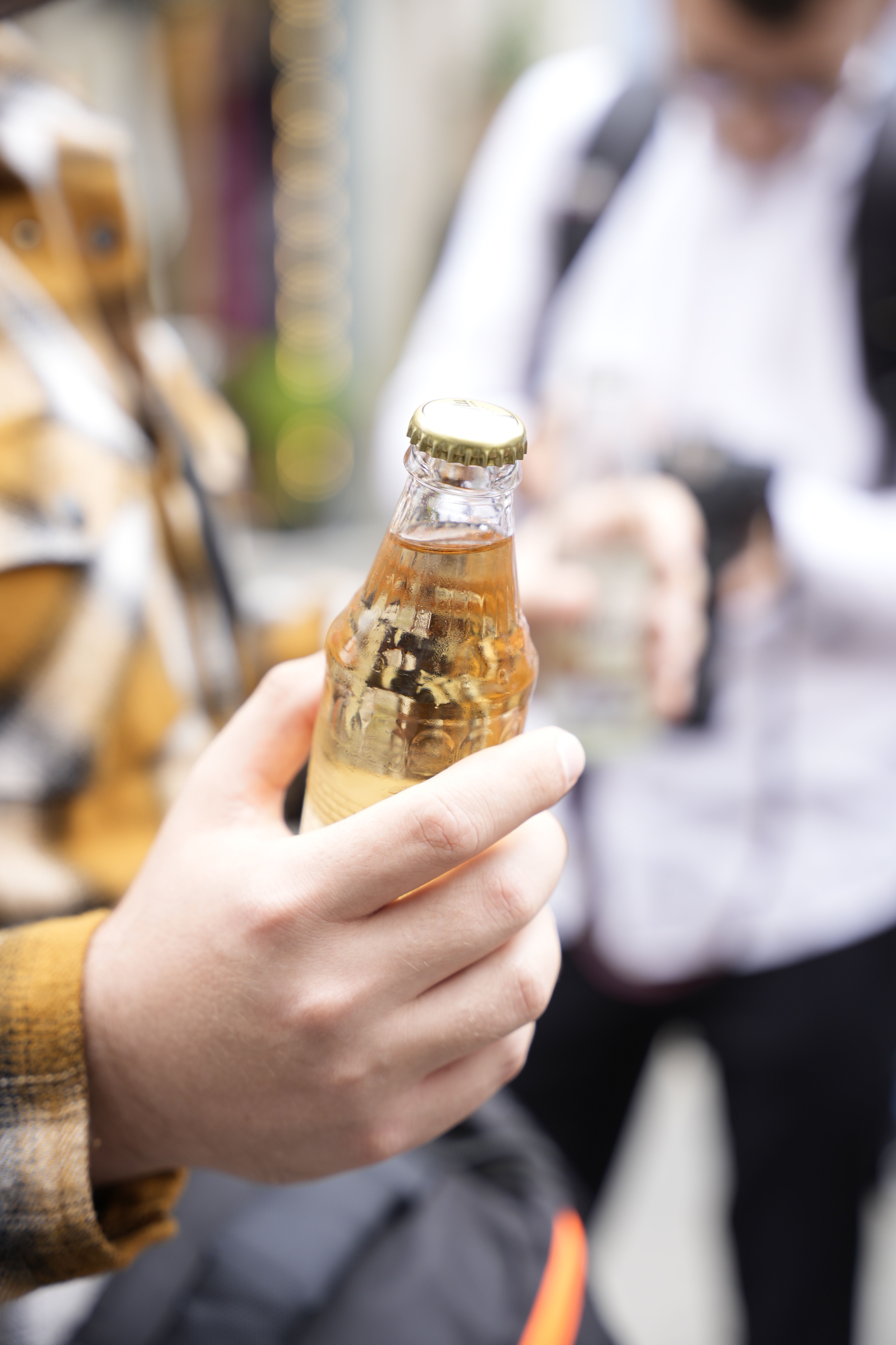 Man Hand Holding Glass Bottle · Free Stock Photo