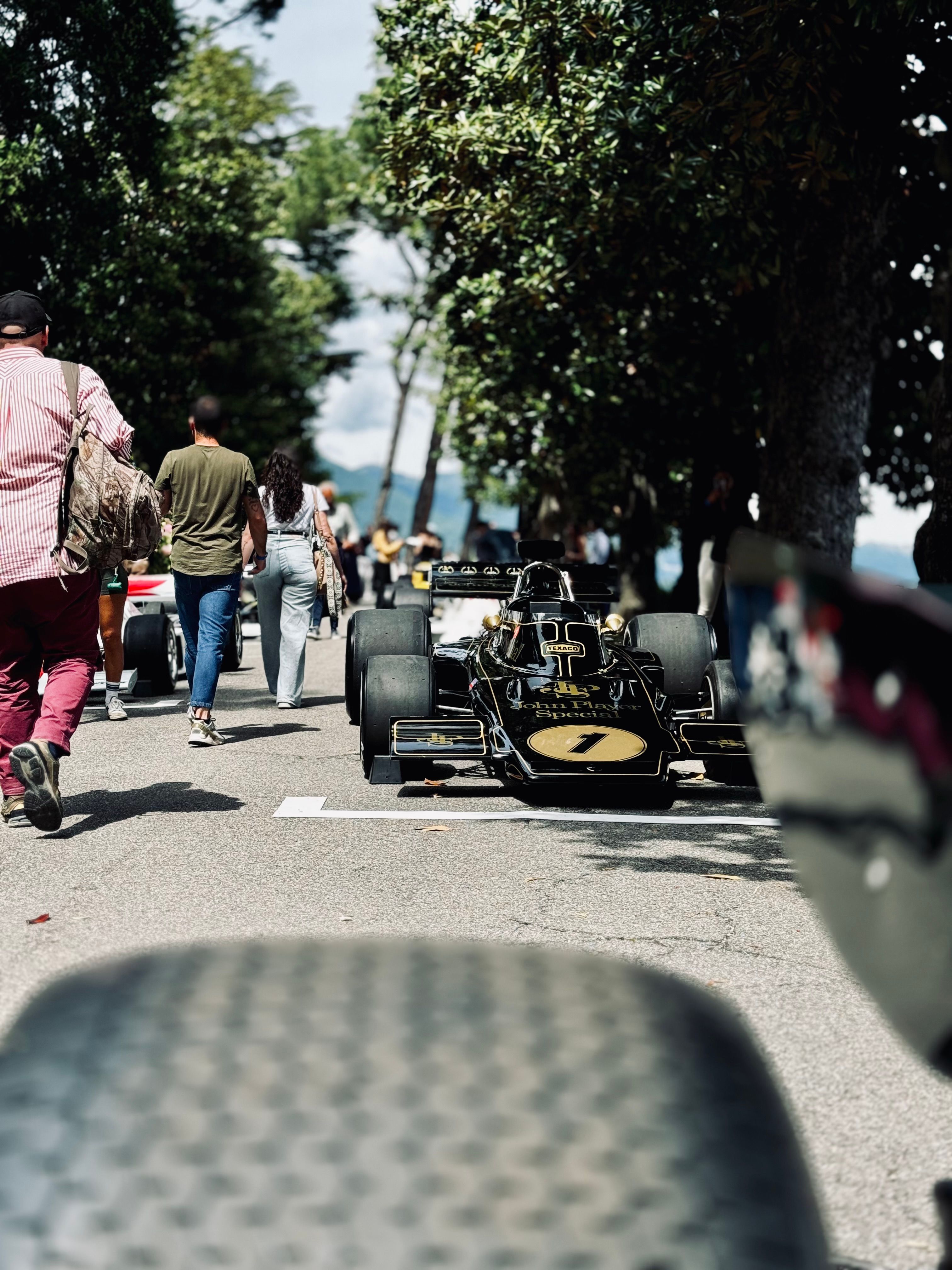 People Walking between Formula 1 Cars Parked on the Track · Free Stock ...