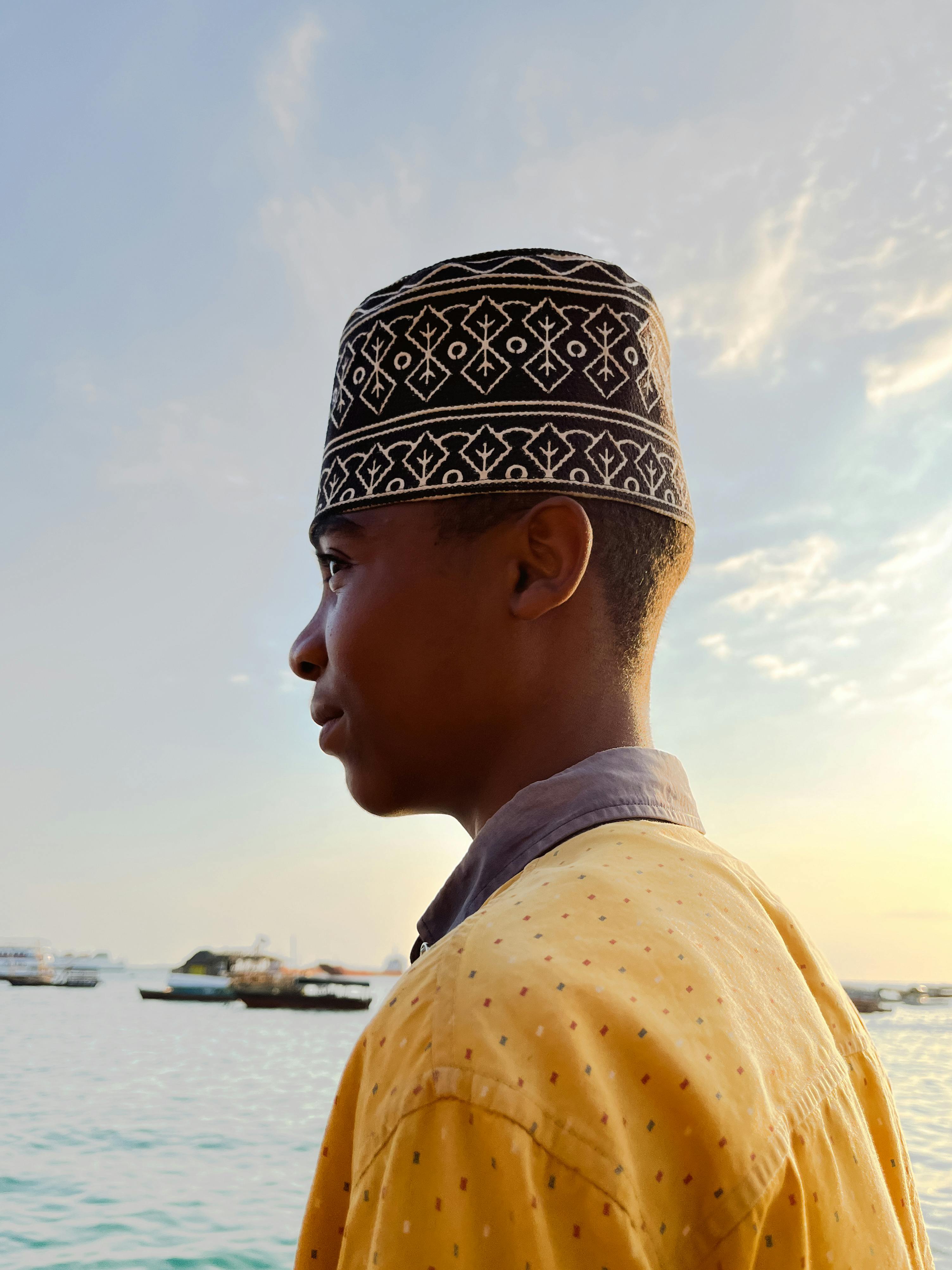Side View of Man Wearing Traditional Religious Hat near Sea · Free ...