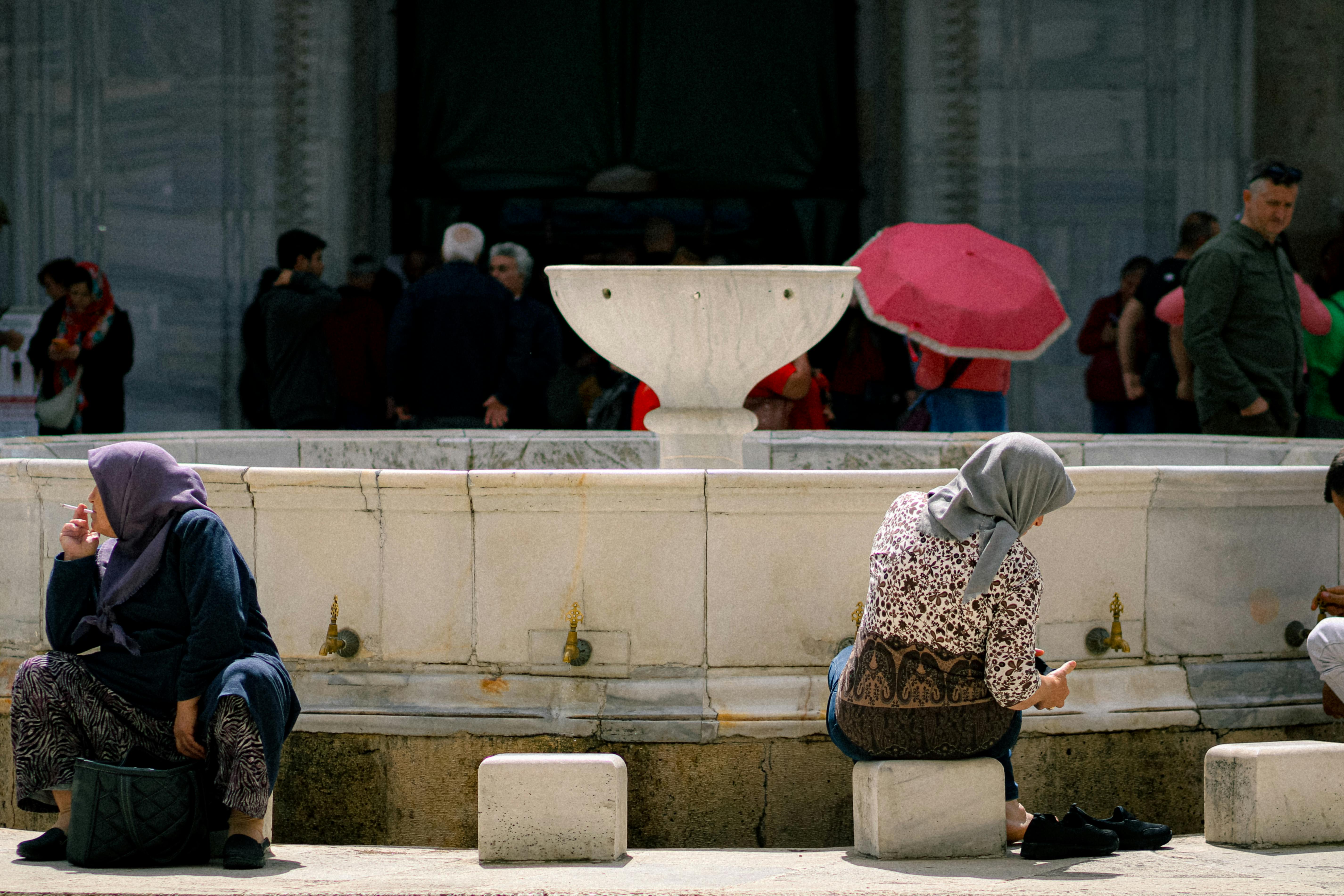 Women Sitting at Ablution Area at Mosque · Free Stock Photo