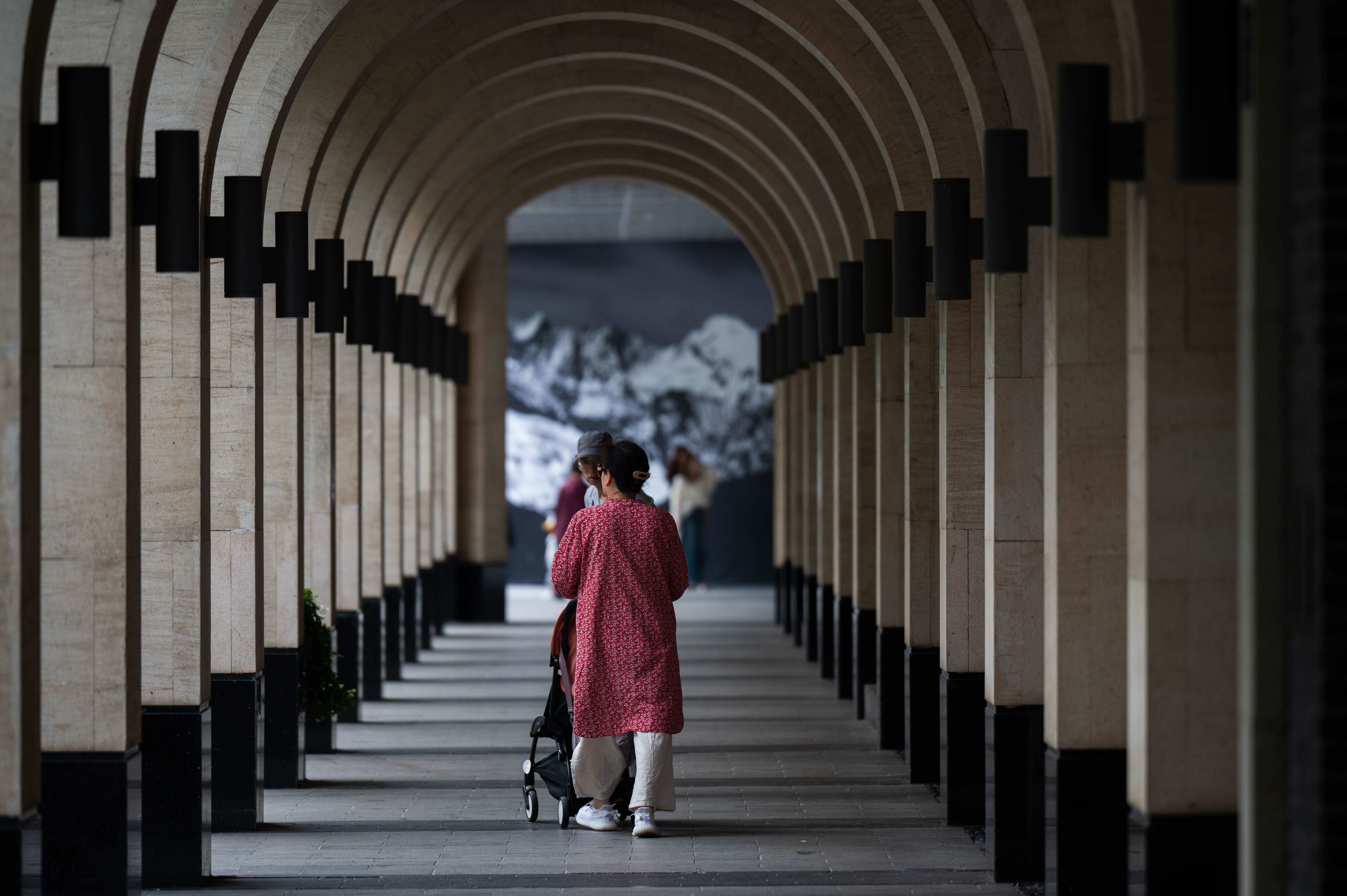 People in Hall Among Arches · Free Stock Photo