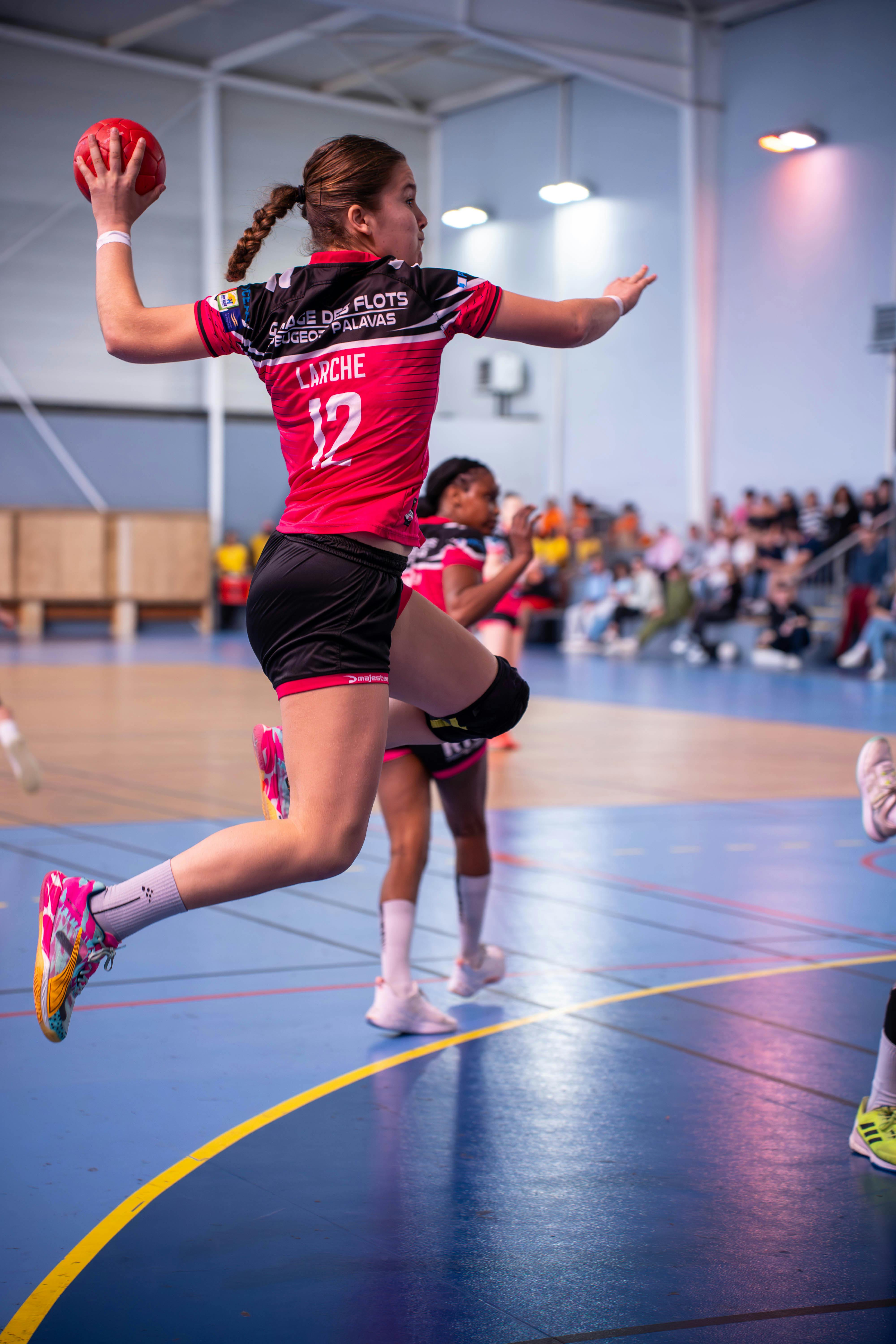 A Handball Player Jumping and Throwing the Ball · Free Stock Photo