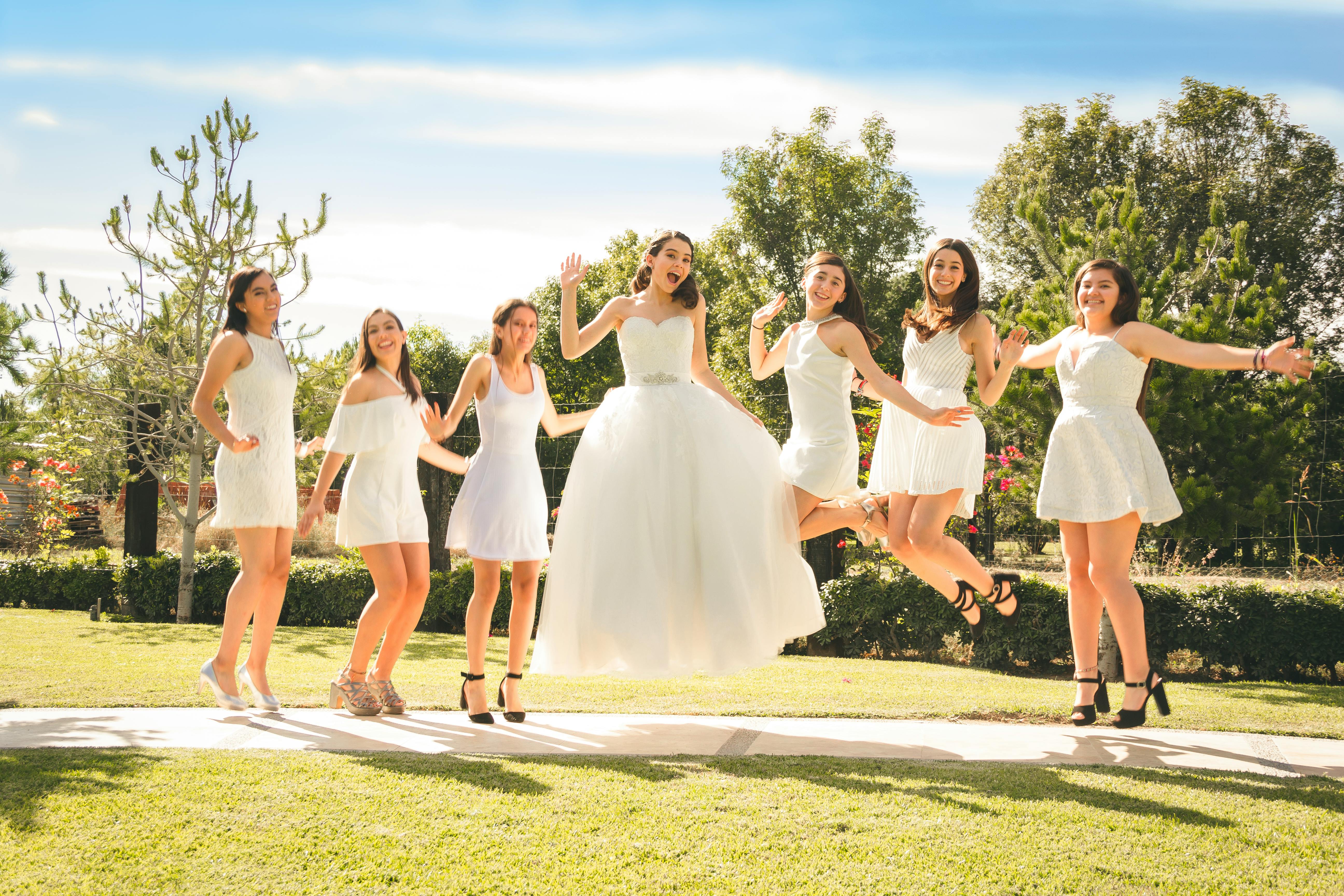 Bride and Bridesmaids Jumping · Free Stock Photo