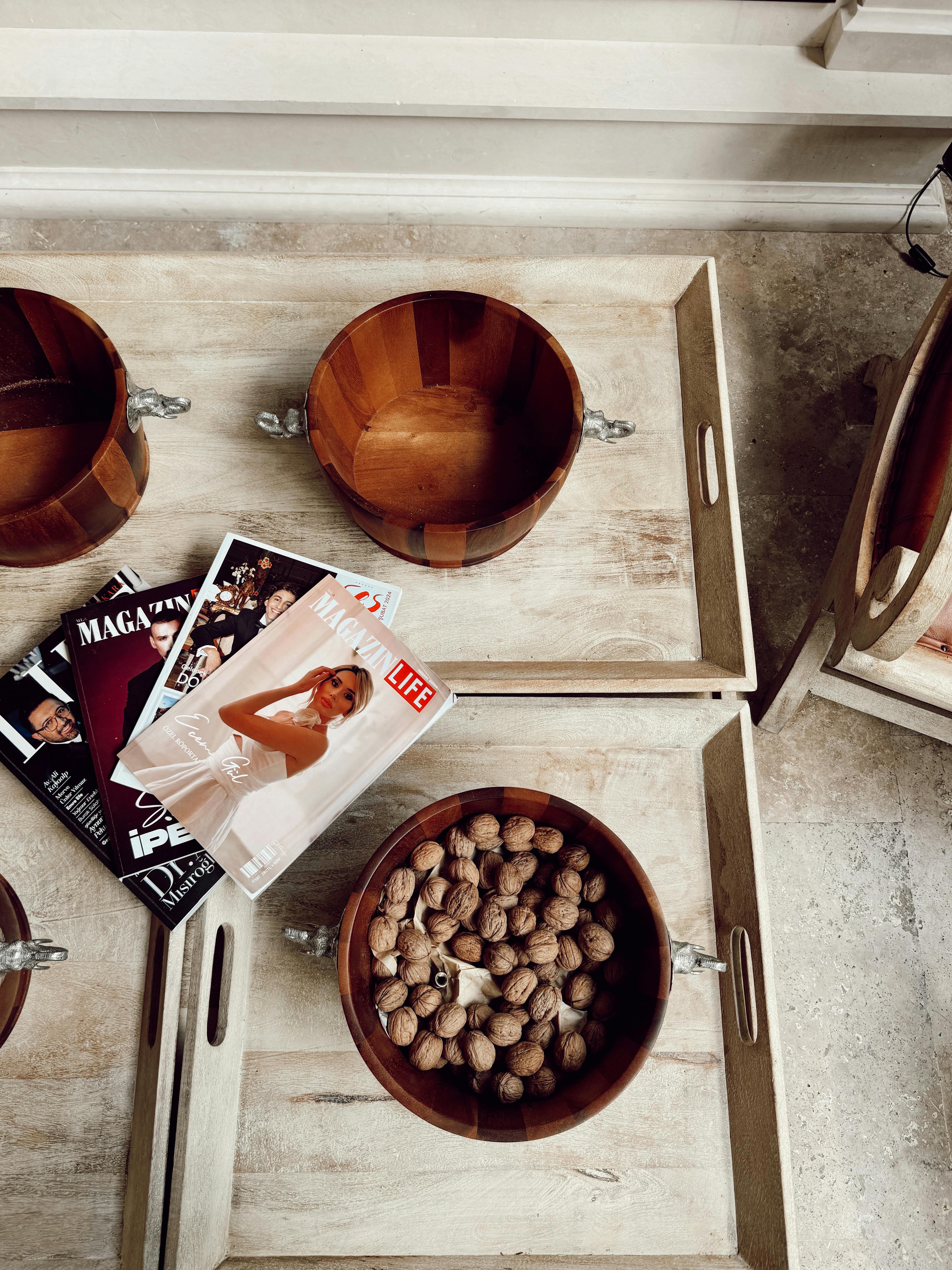 Magazines Next to a Bowl of Nuts · Free Stock Photo
