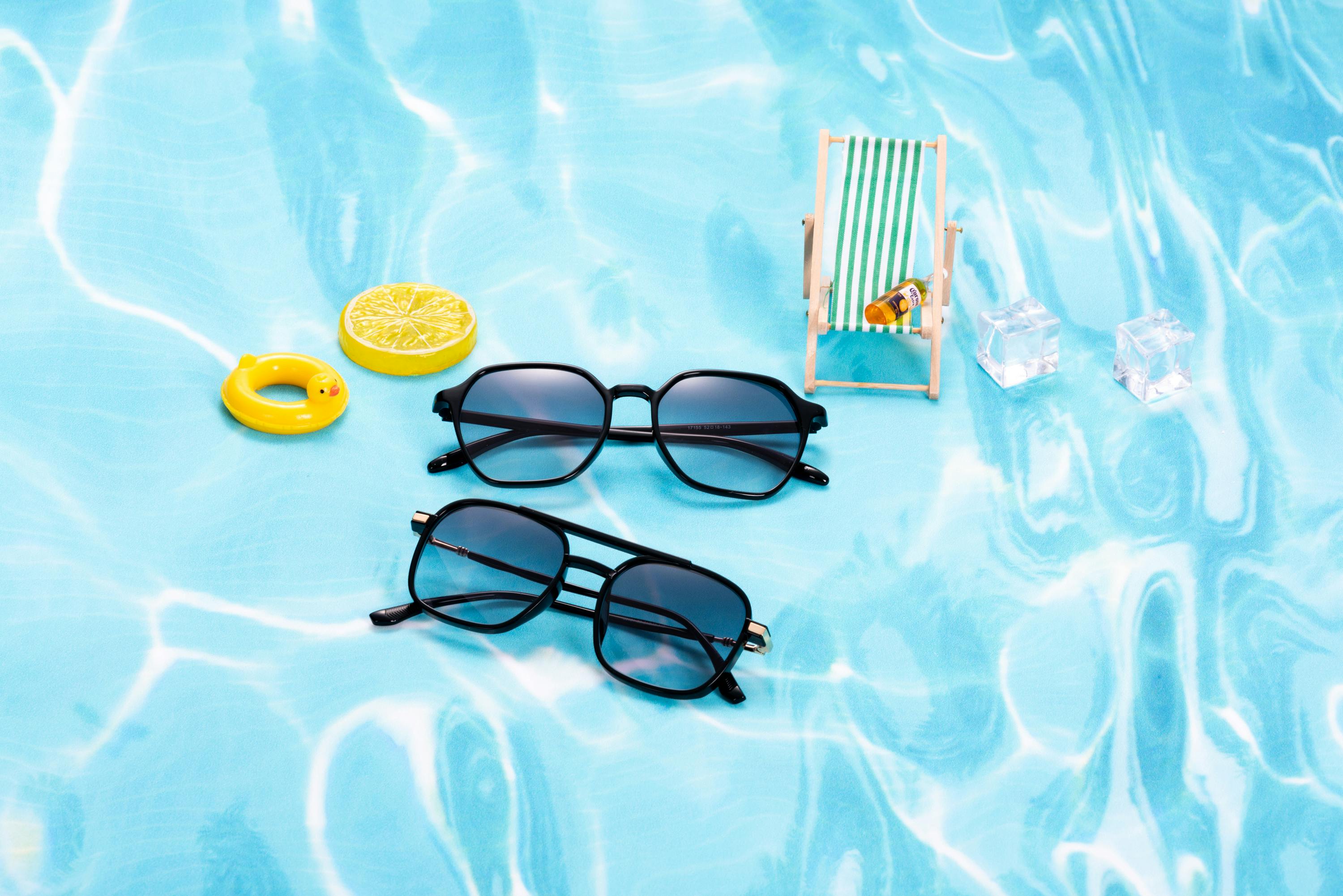 Summer Themed Items on a Water Surface Background · Free Stock Photo