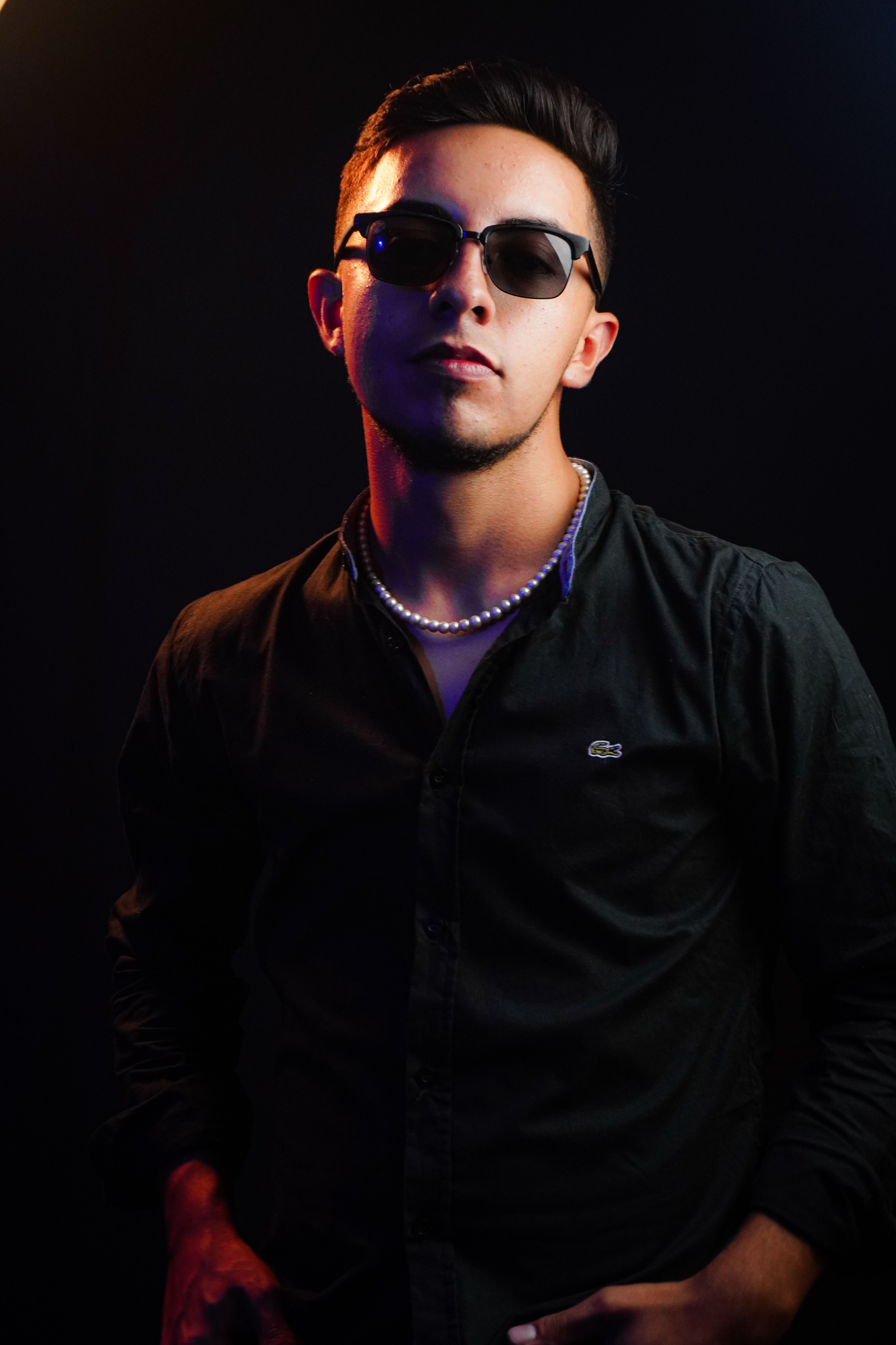 Portrait of Man Wearing Sunglasses in Shadow · Free Stock Photo