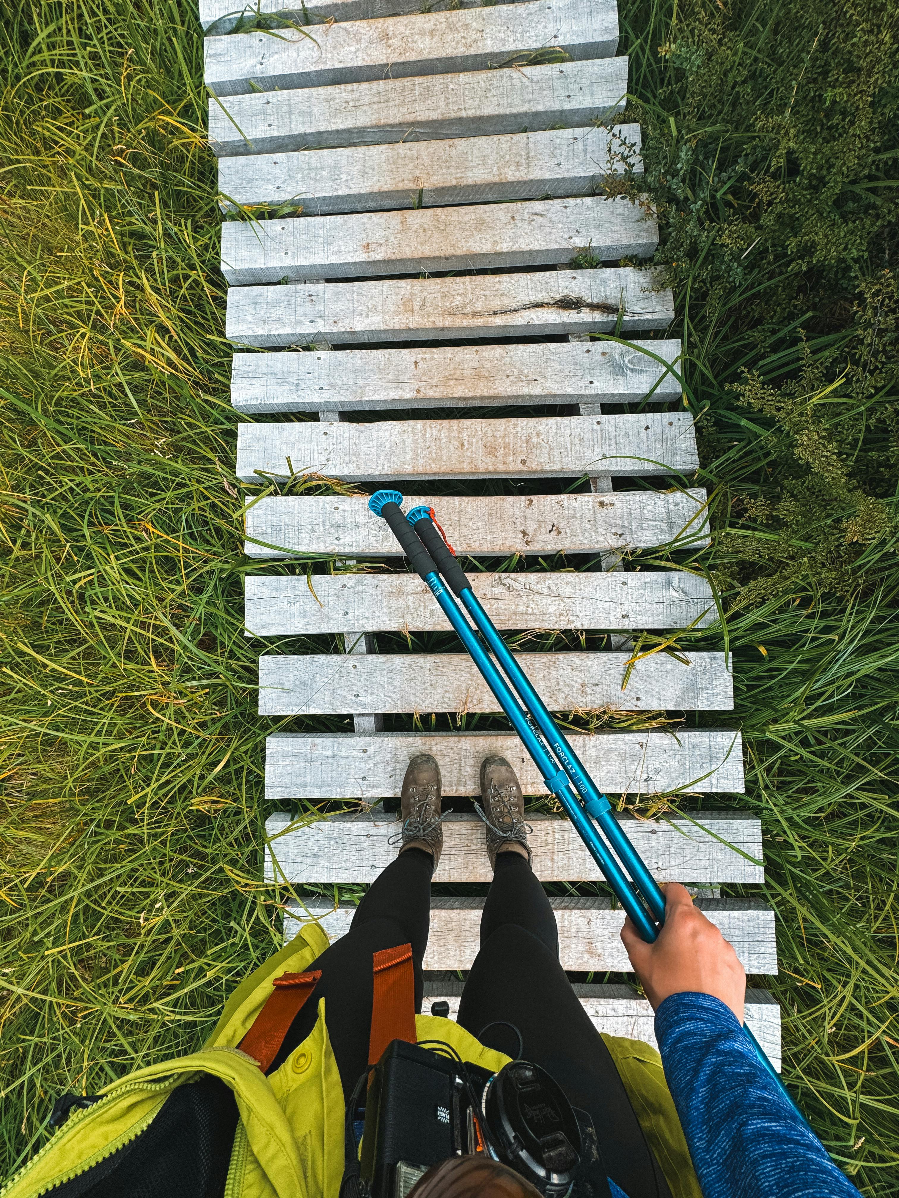 Man with Sticks on Wooden Path · Free Stock Photo