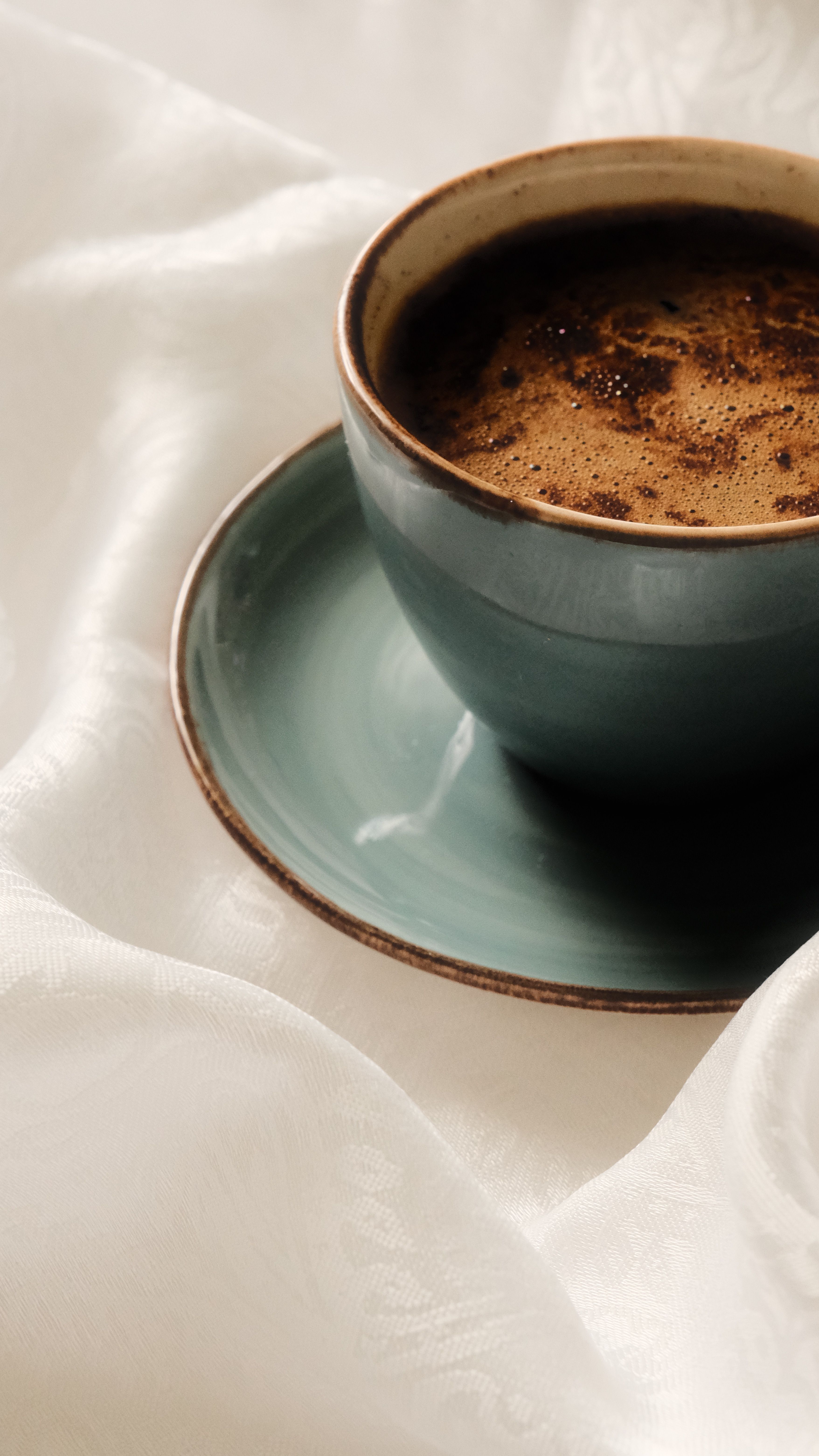 Elegant Espresso Cup in Sunlight · Free Stock Photo