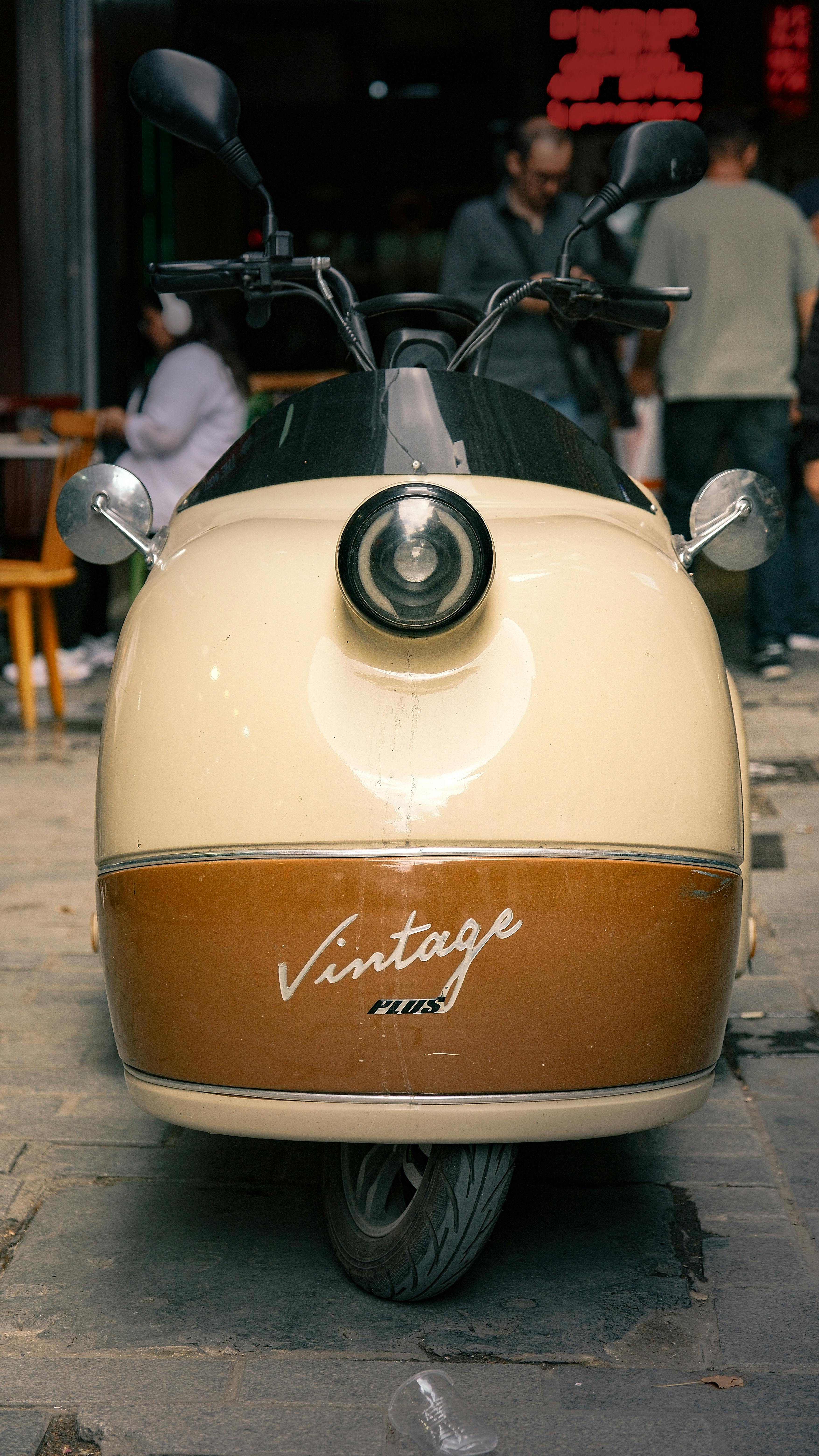 Vintage Beige Scooter on Sidewalk · Free Stock Photo