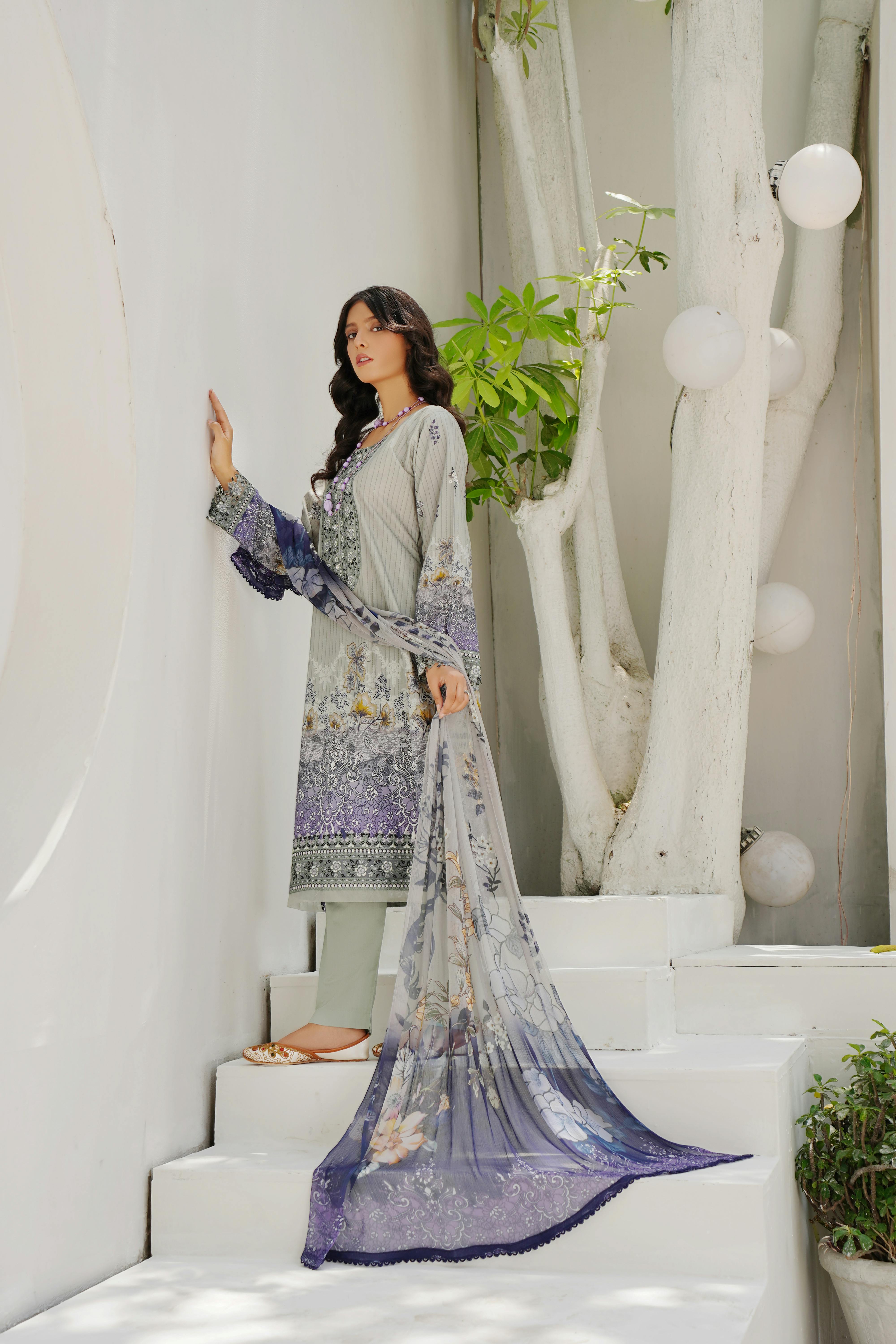 Model in a Gray Dress with Purple Embroidery and a Scarf · Free Stock Photo