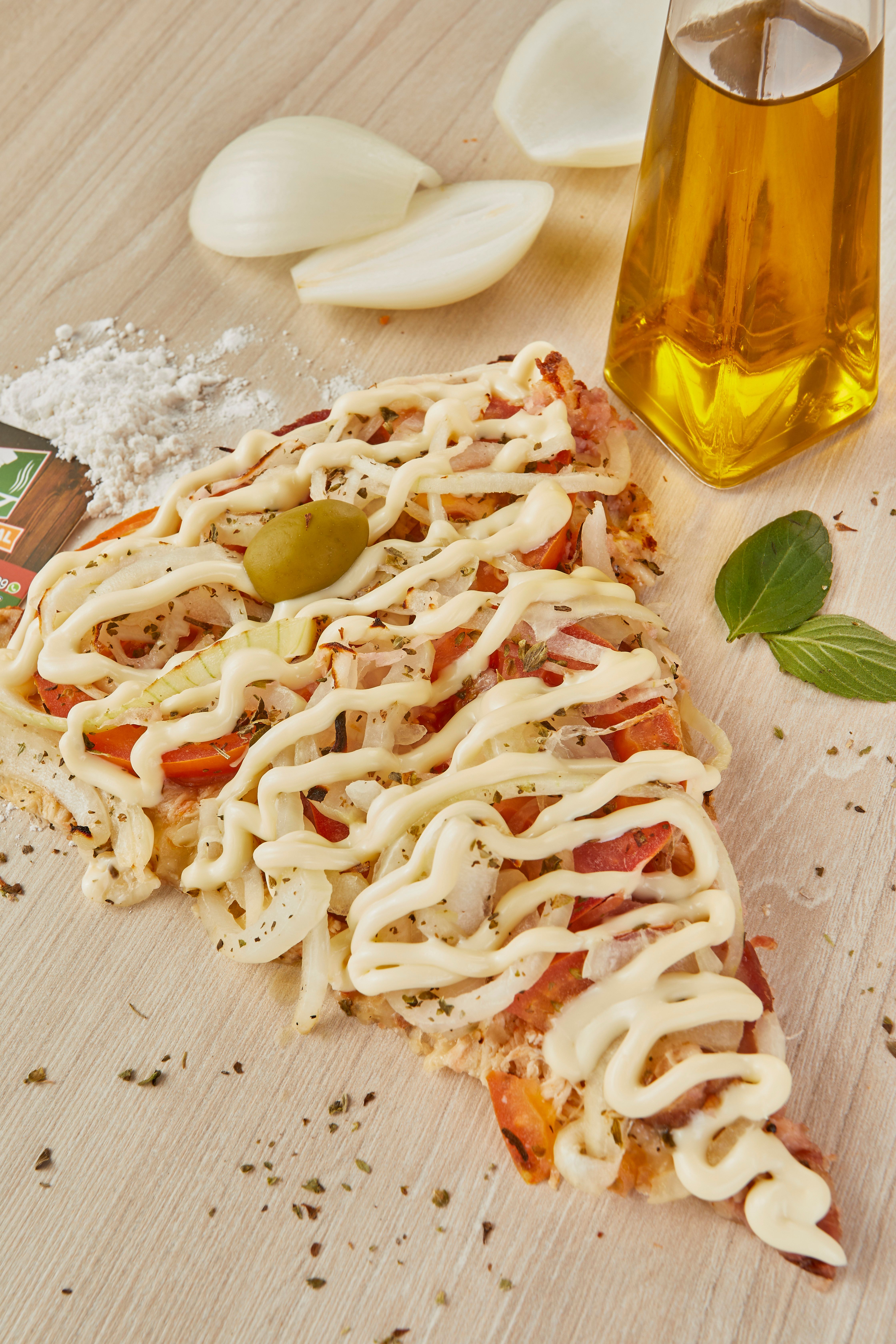 Slice of Pizza with Ham Topped with Spray Cheese · Free Stock Photo