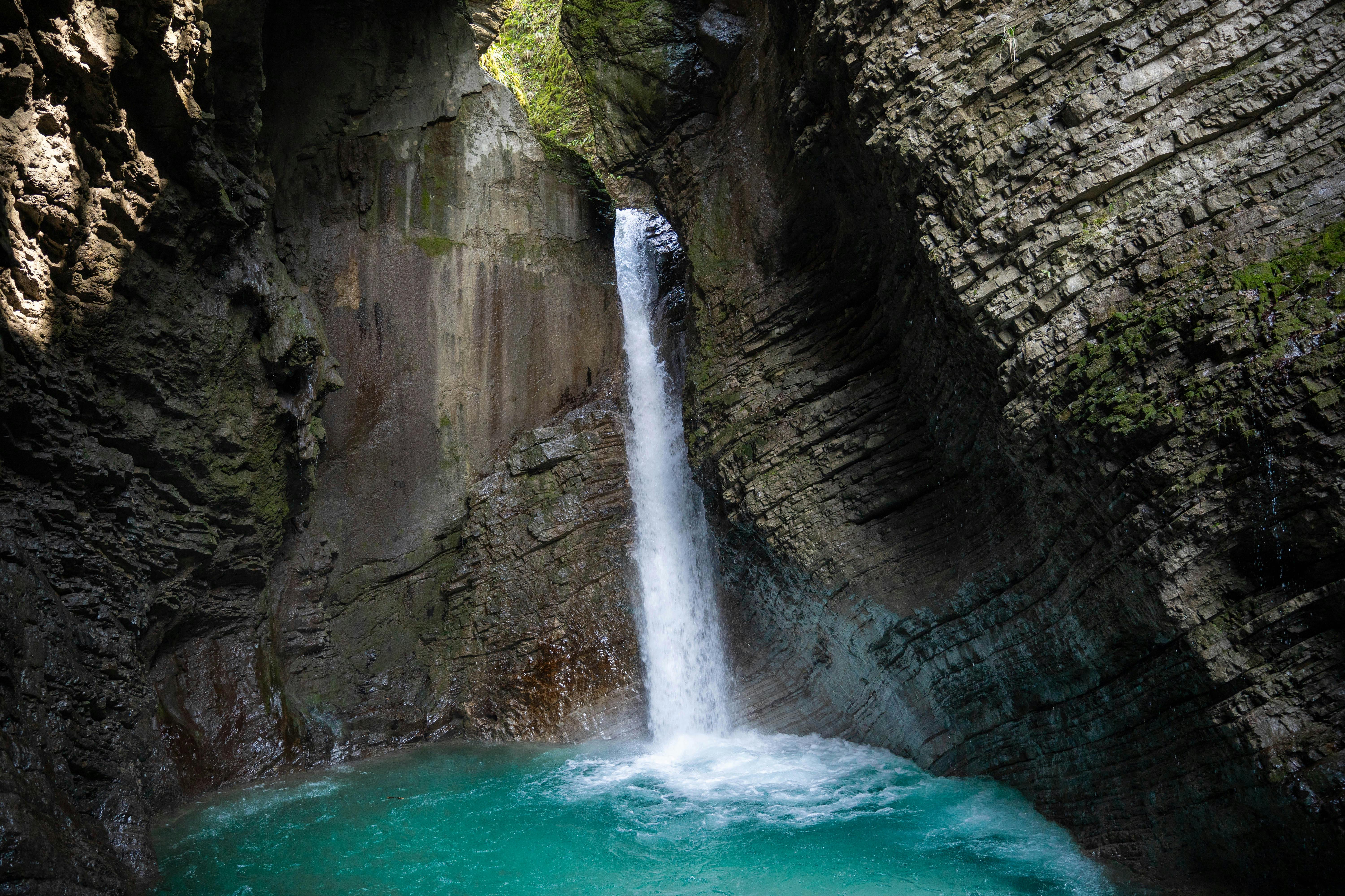 A Person Under The Flowing Waterfall · Free Stock Photo