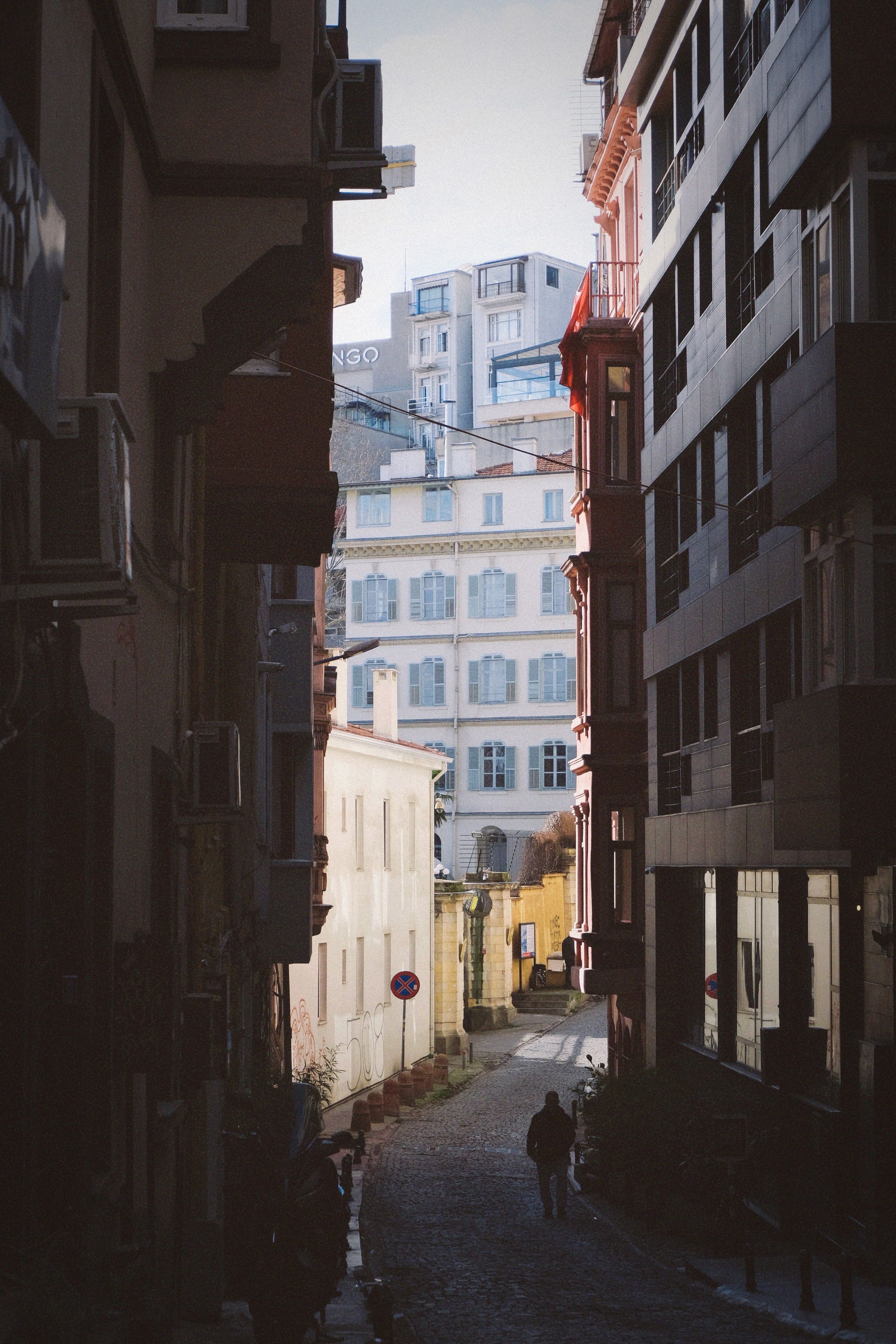 Person Walking a Narrow Street in Paris · Free Stock Photo