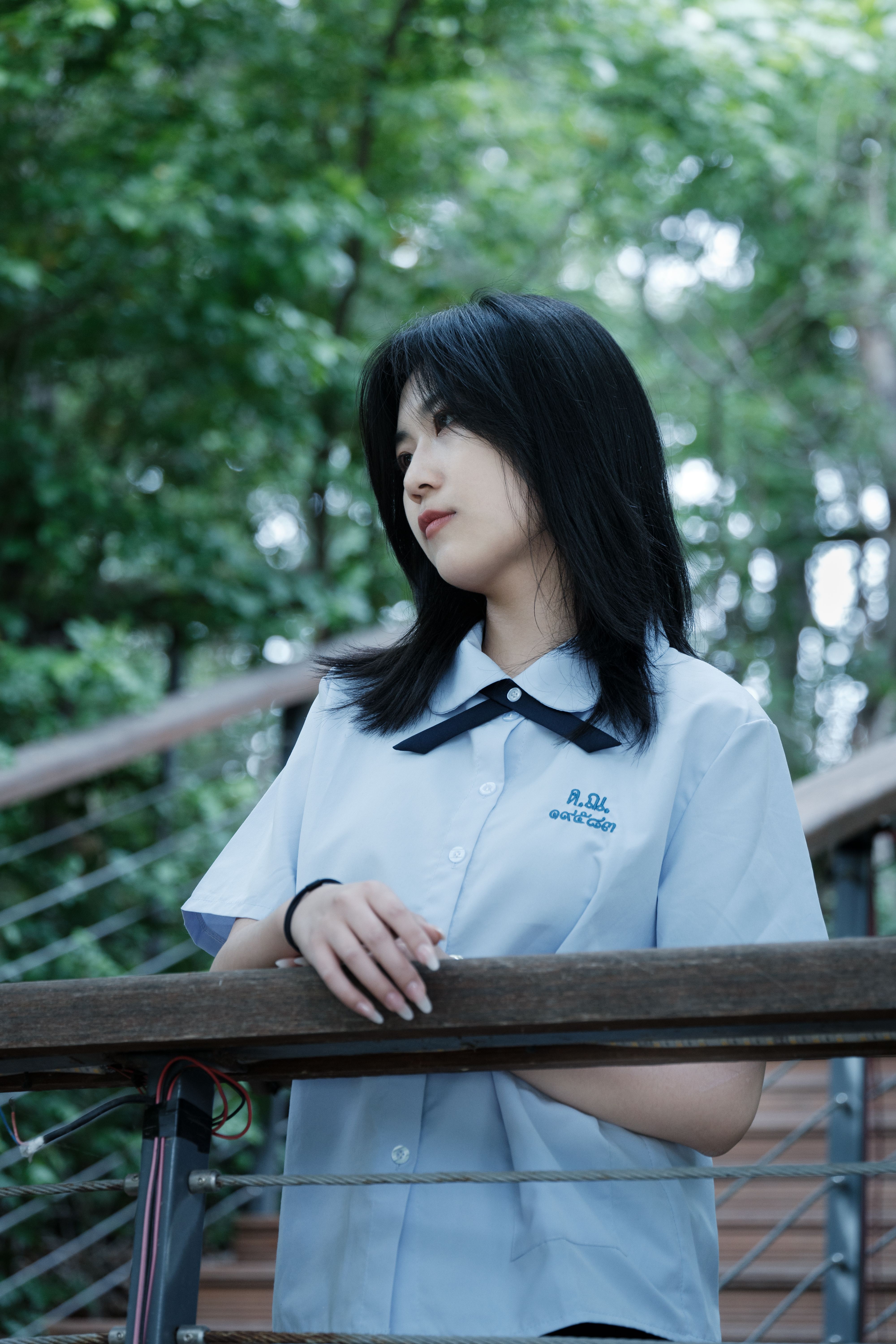 Brunette Woman Posing Wearing Light Blue Uniform Shirt in Park · Free ...