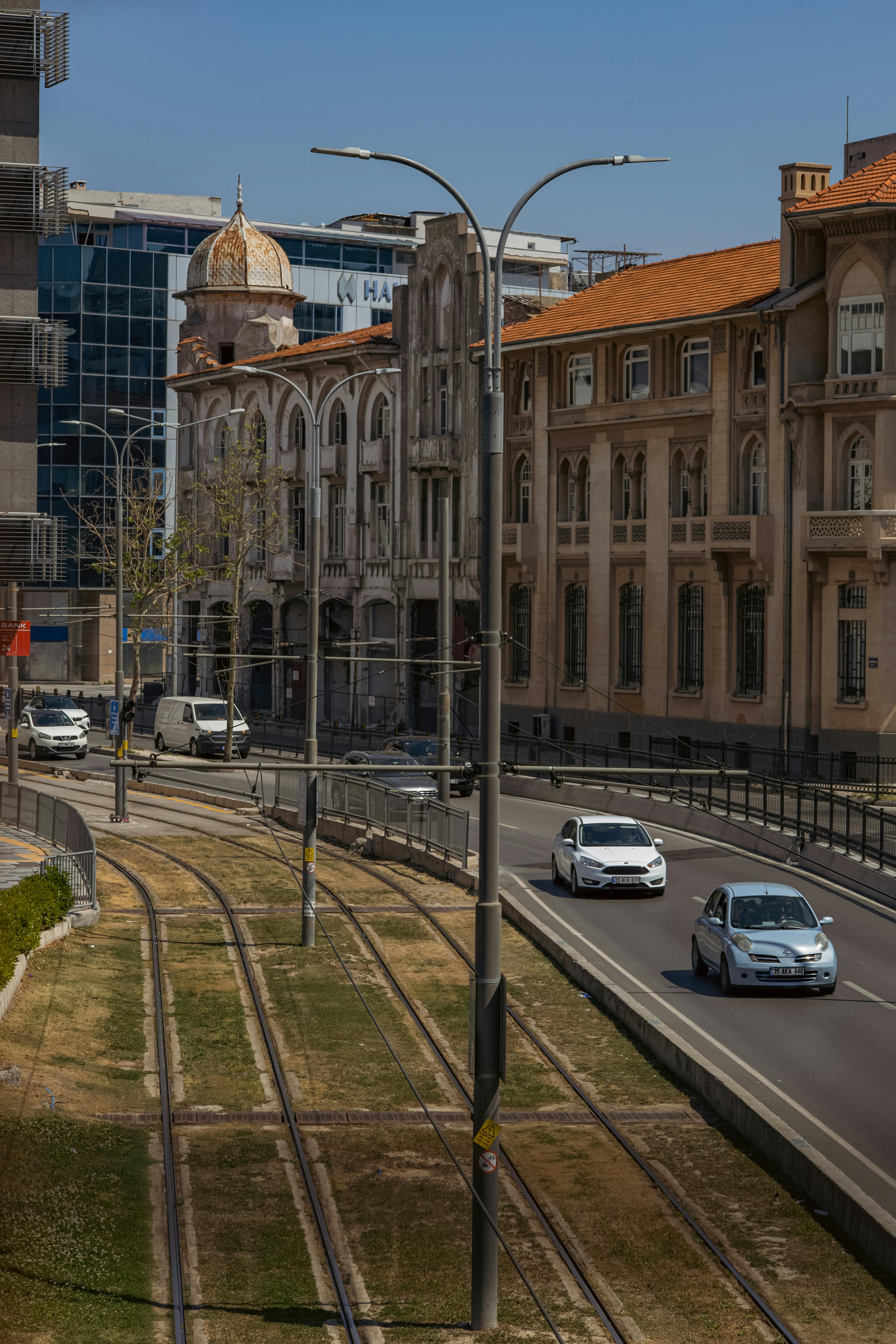 City Street with Cars and Railway Tram Tracks Surrounded by Buildings ...