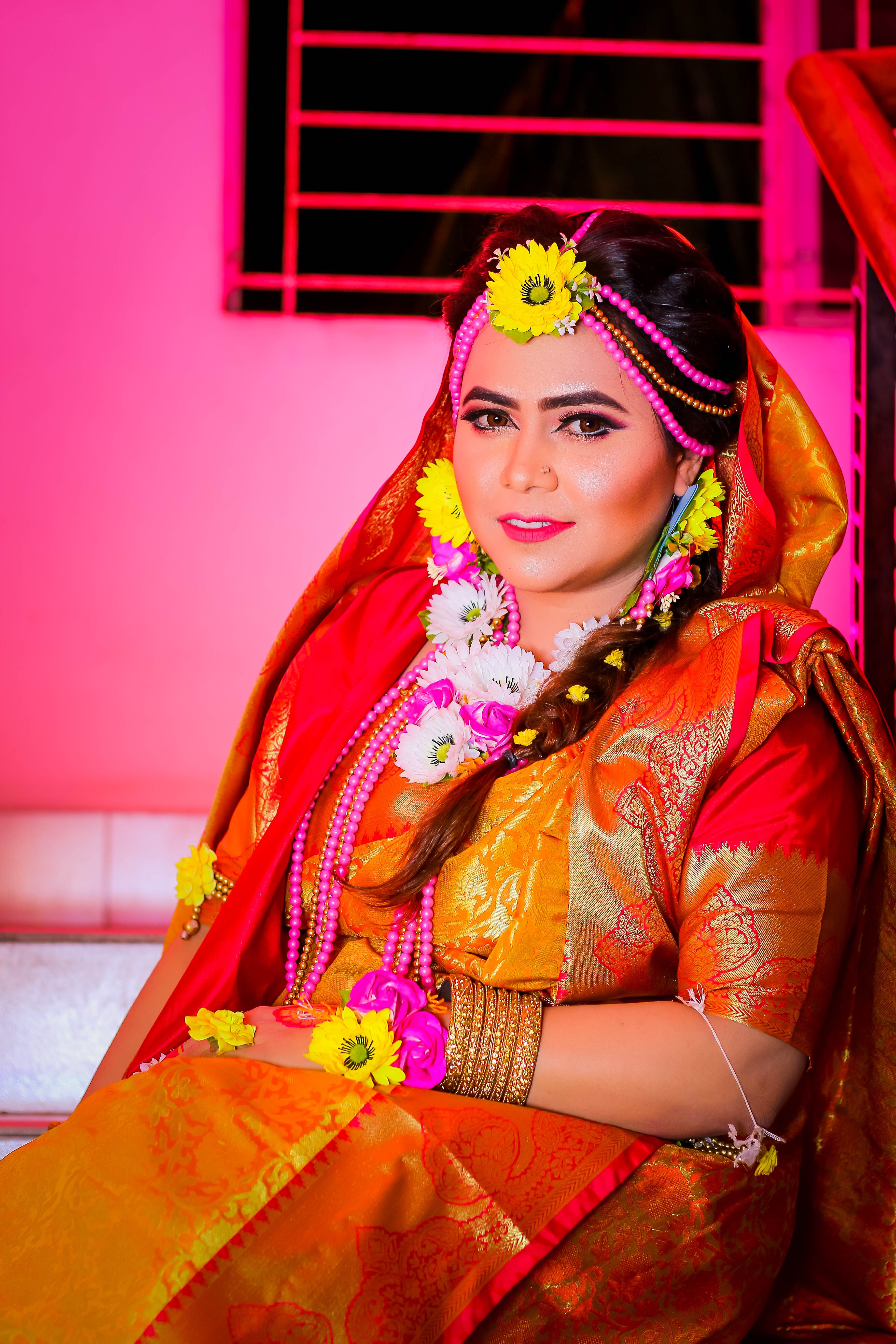 A woman in traditional indian attire posing for the camera · Free Stock ...