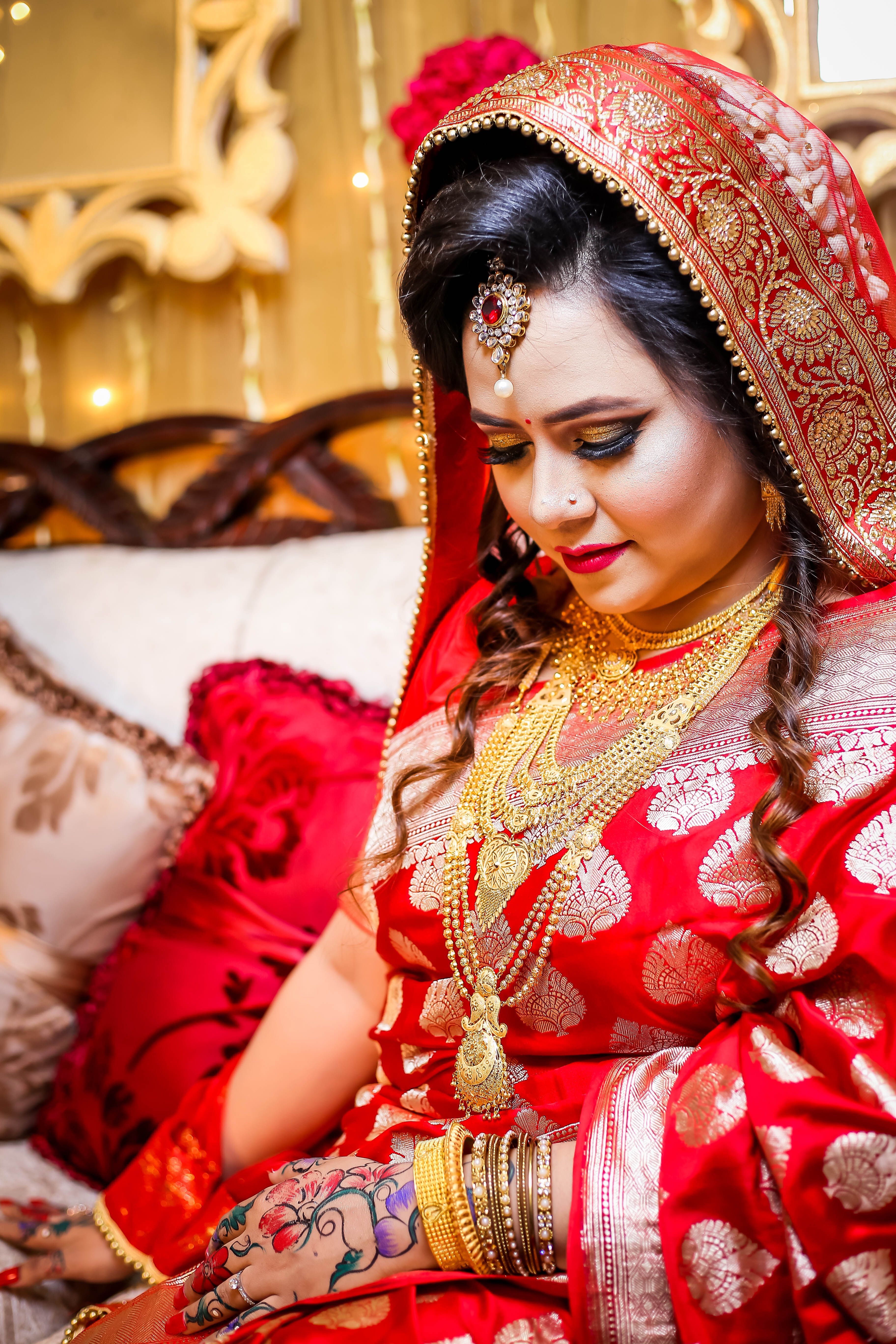 Woman Sitting in Traditional Wedding Dress and Veil · Free Stock Photo