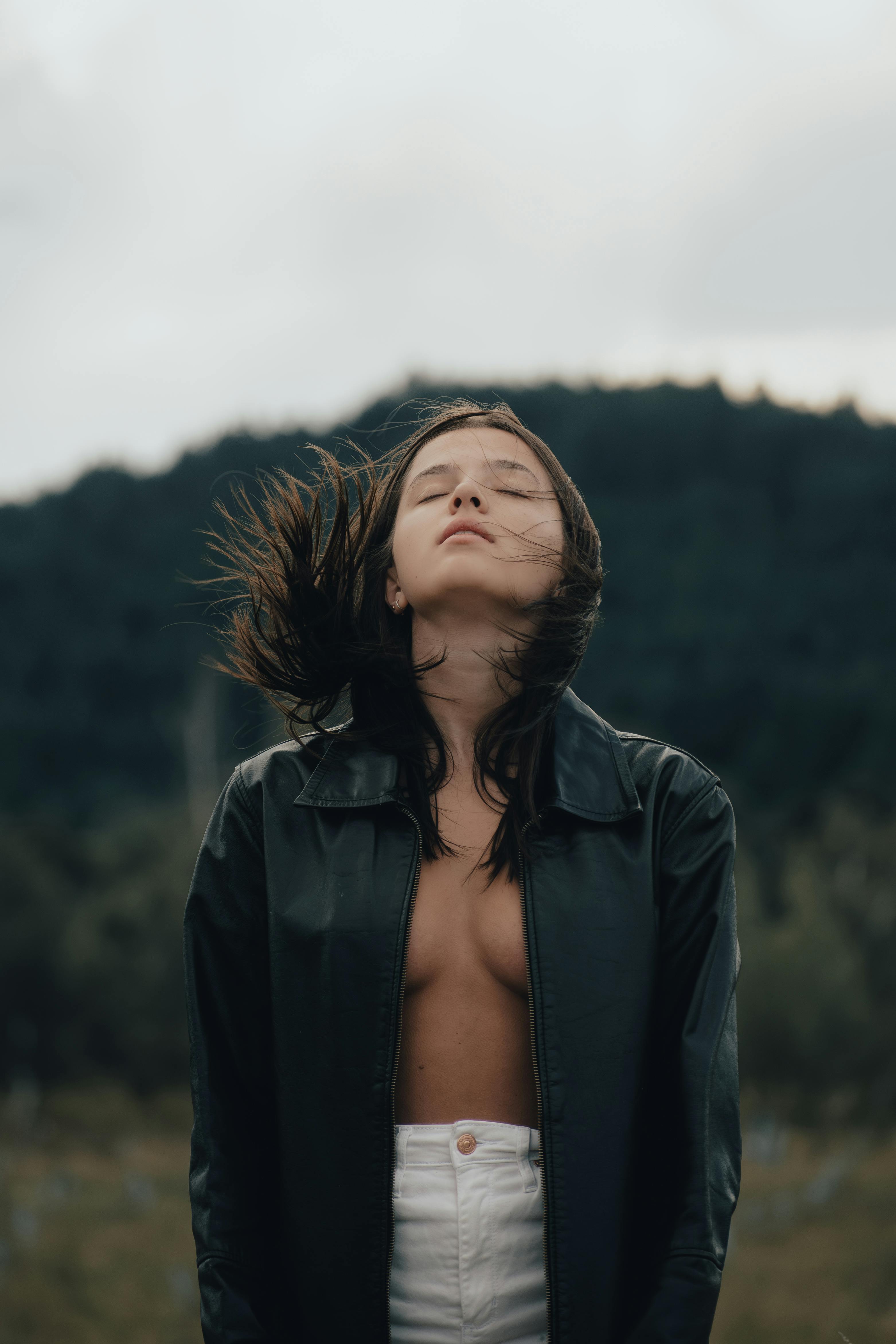 Woman in Unzipped Leather Jacket · Free Stock Photo