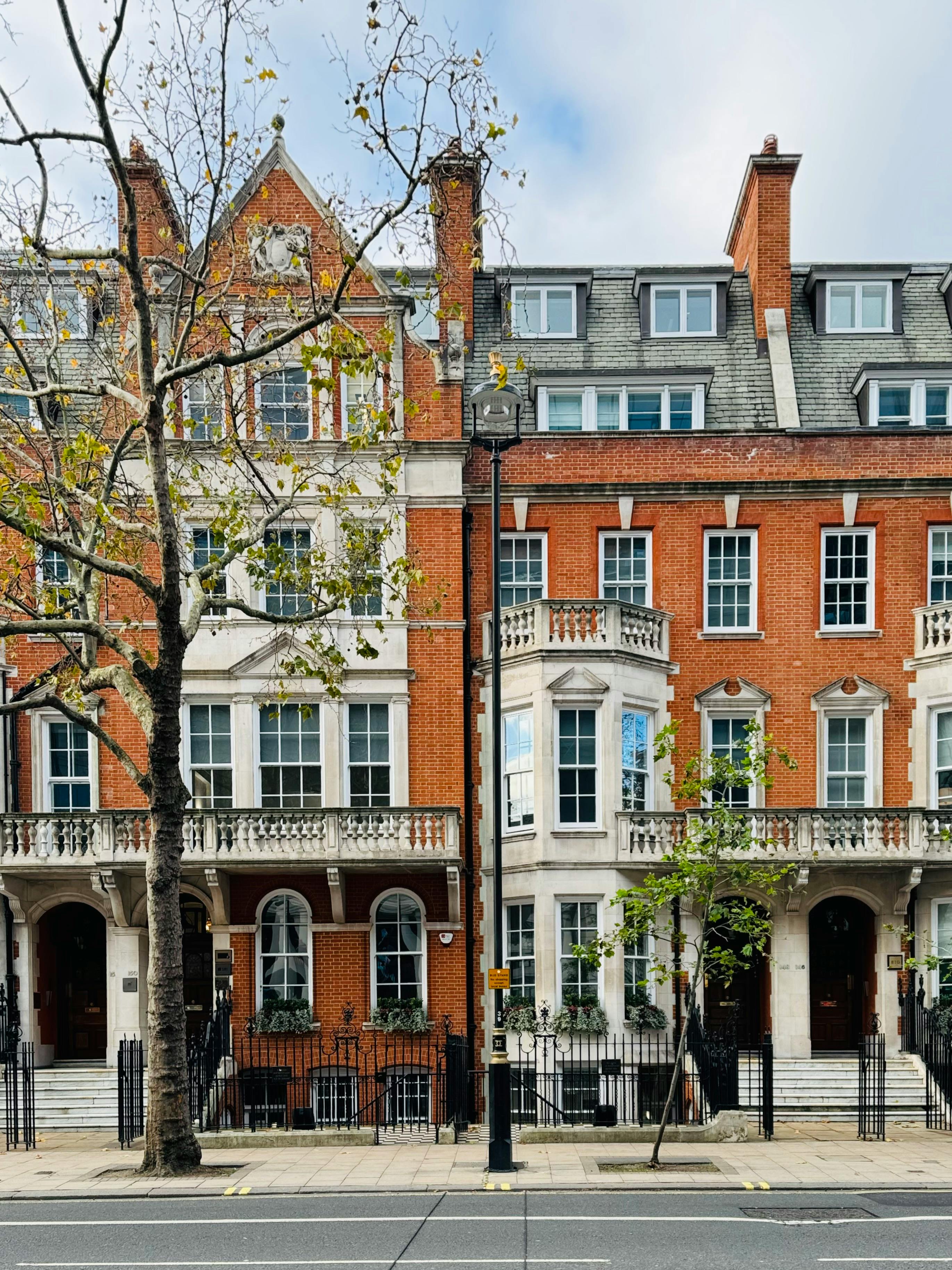 Brick Tenements by the Street in London · Free Stock Photo