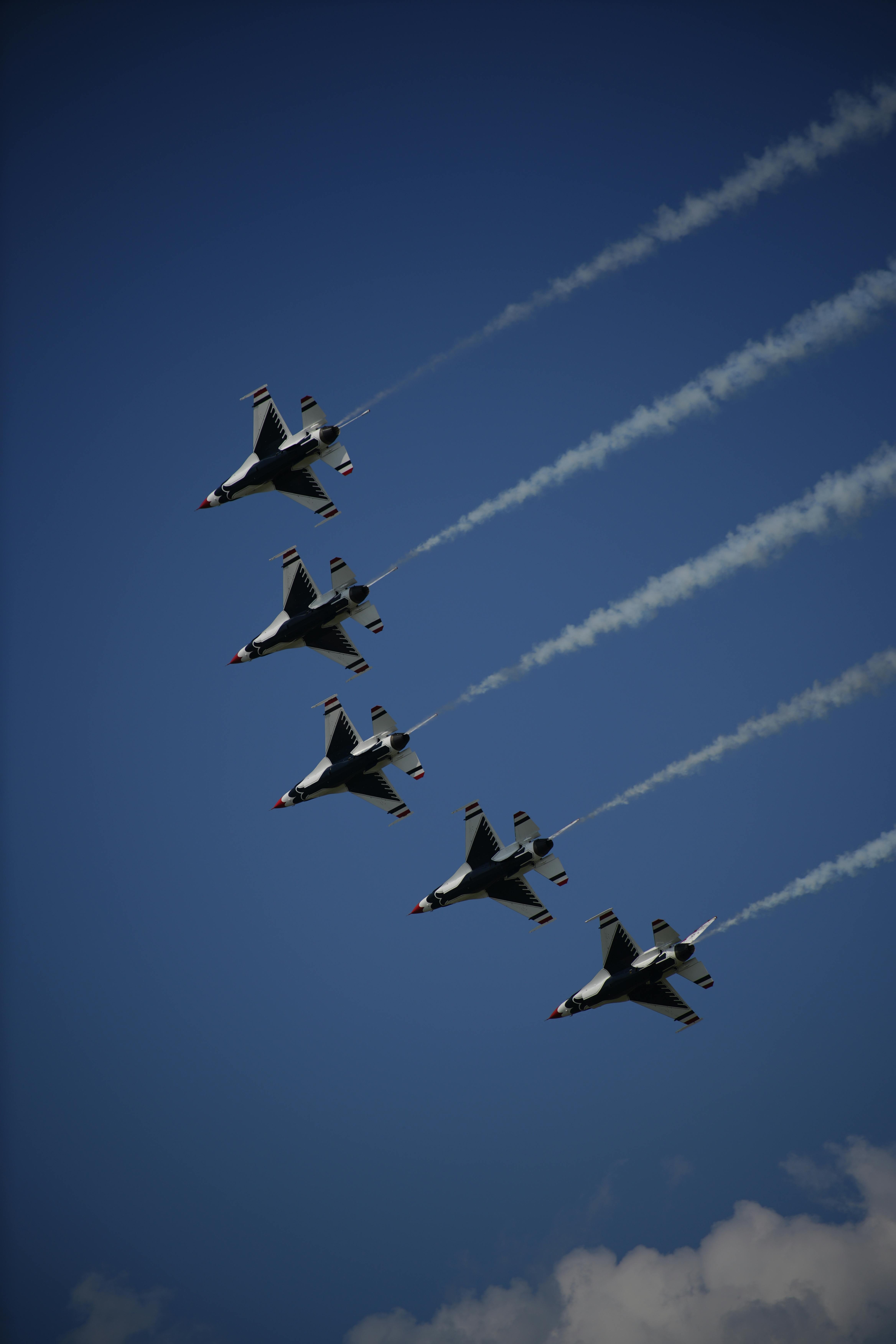 Four jets flying in formation in the sky · Free Stock Photo