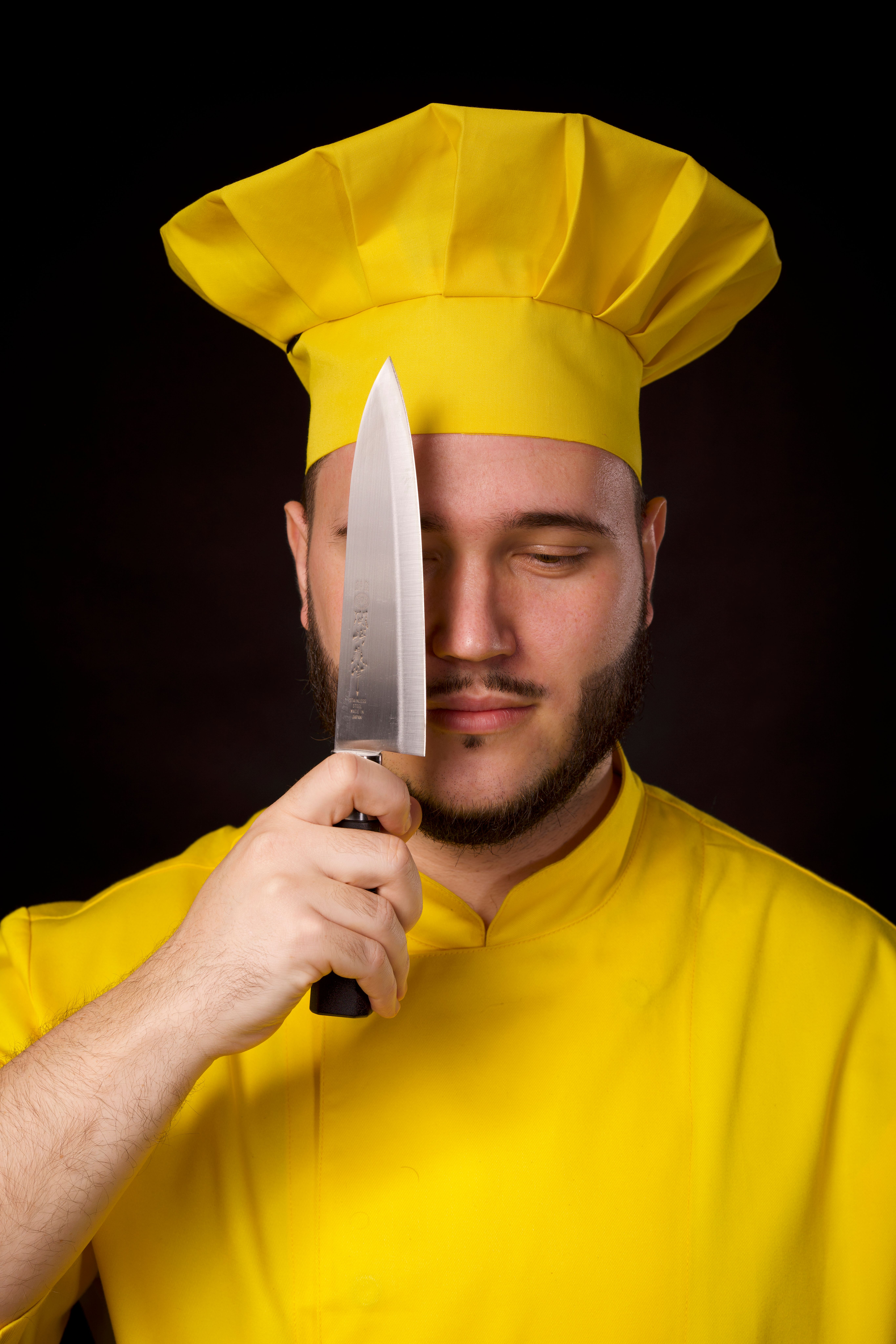 Chef Holding Knife in Front of Face · Free Stock Photo