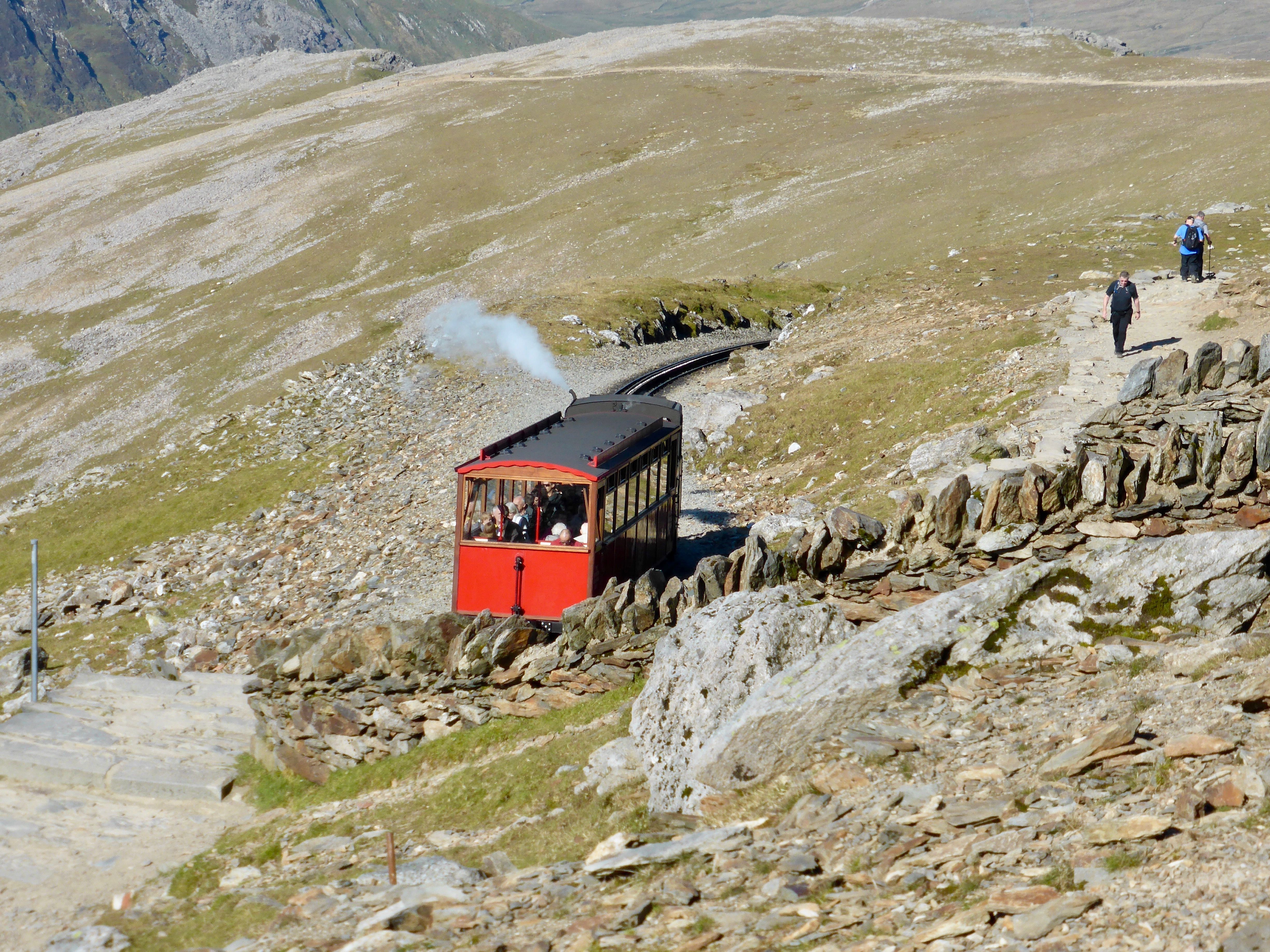 People in Red Wagon on Hillside · Free Stock Photo
