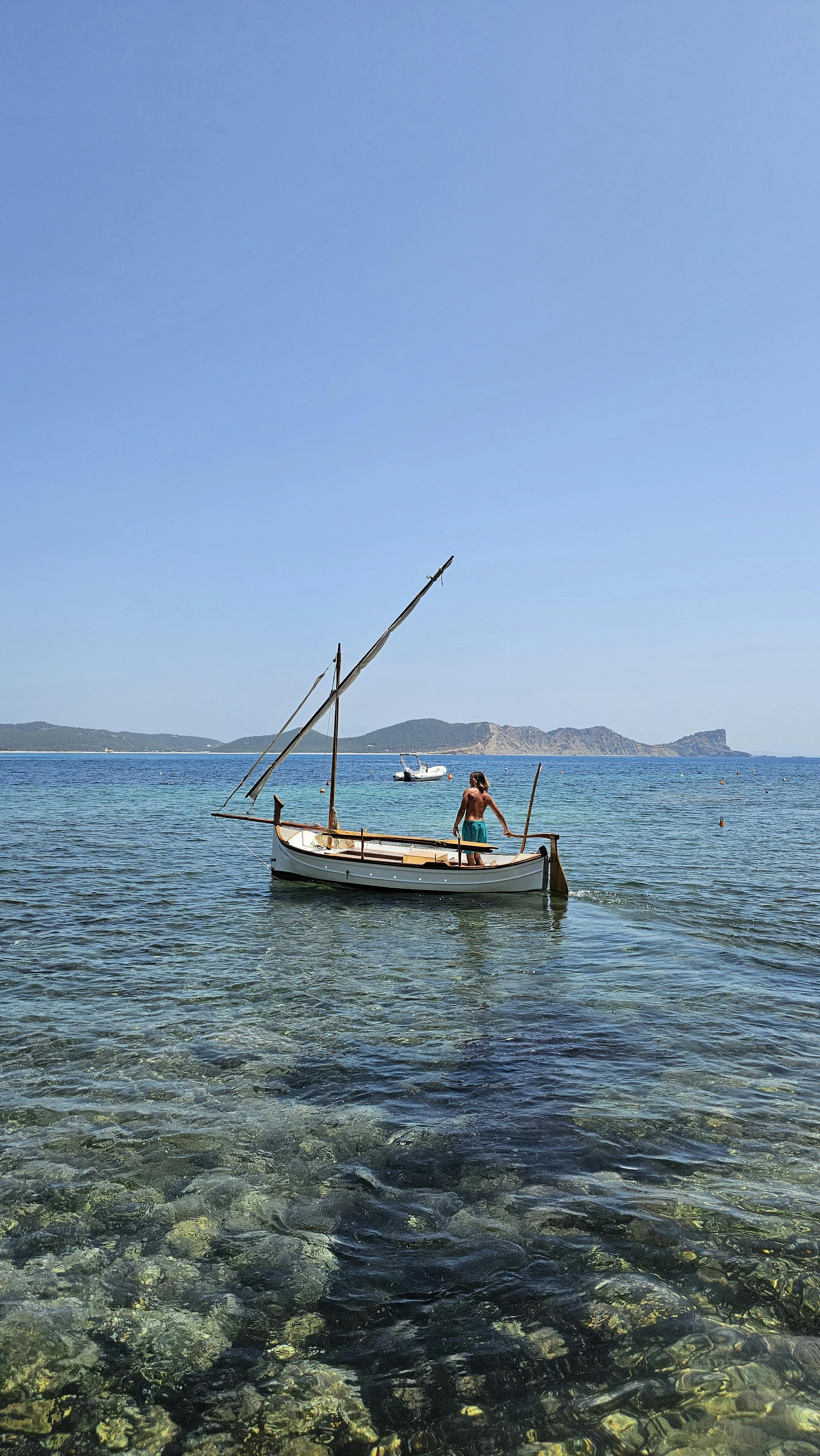Person on a Boat in the Sea · Free Stock Photo