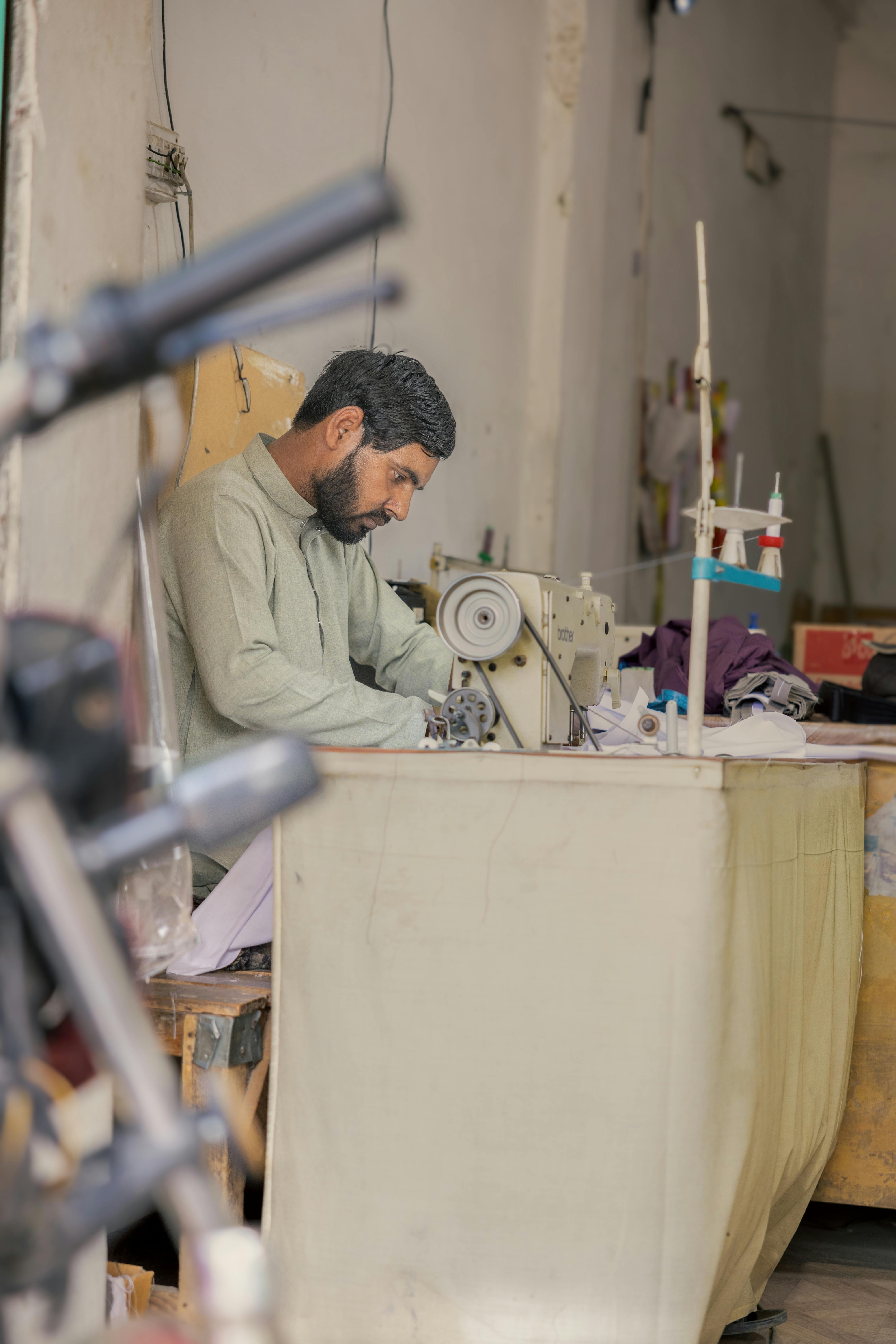 Tailor Working at Workshop · Free Stock Photo