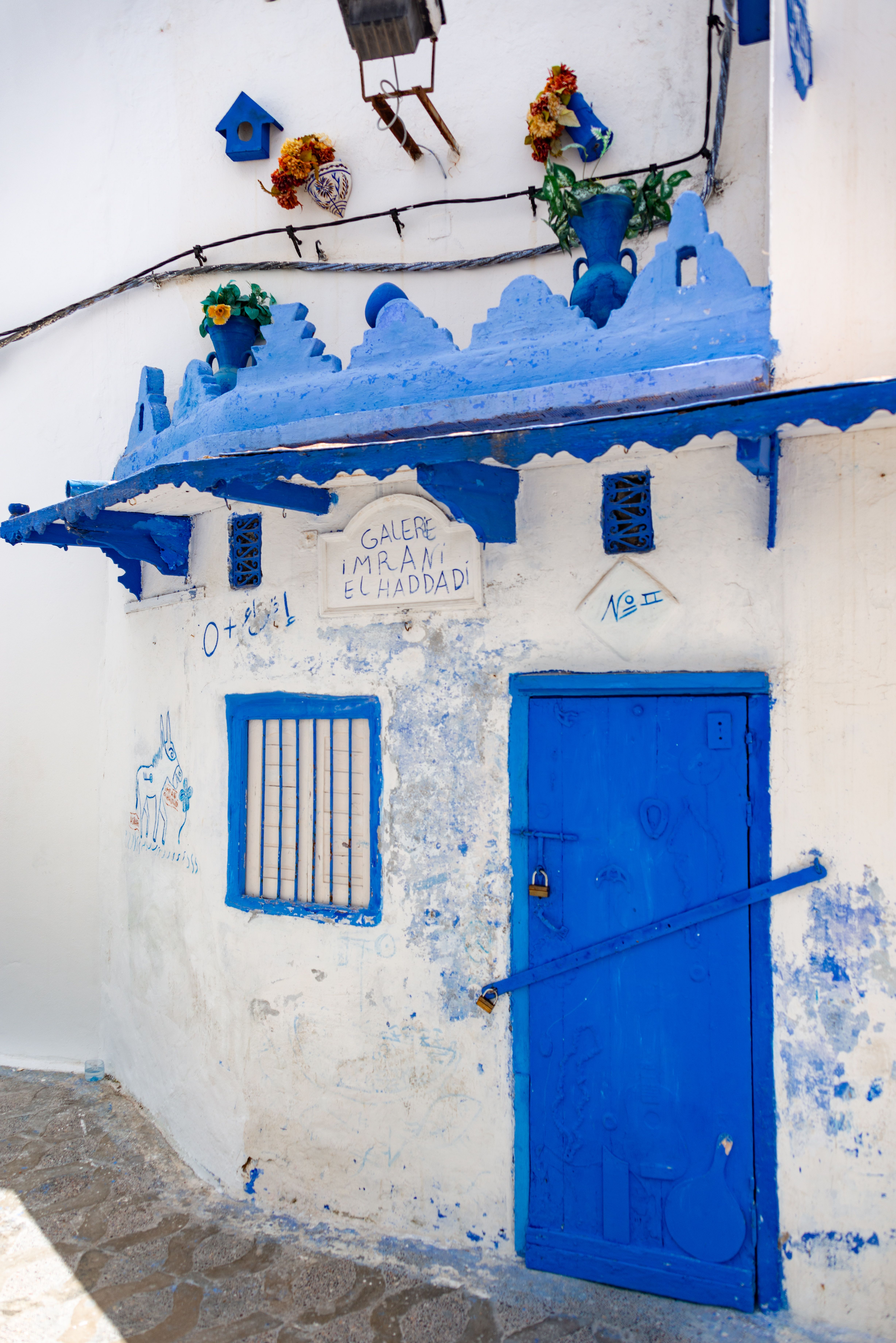 Exterior of a White Building with Blue Elements · Free Stock Photo
