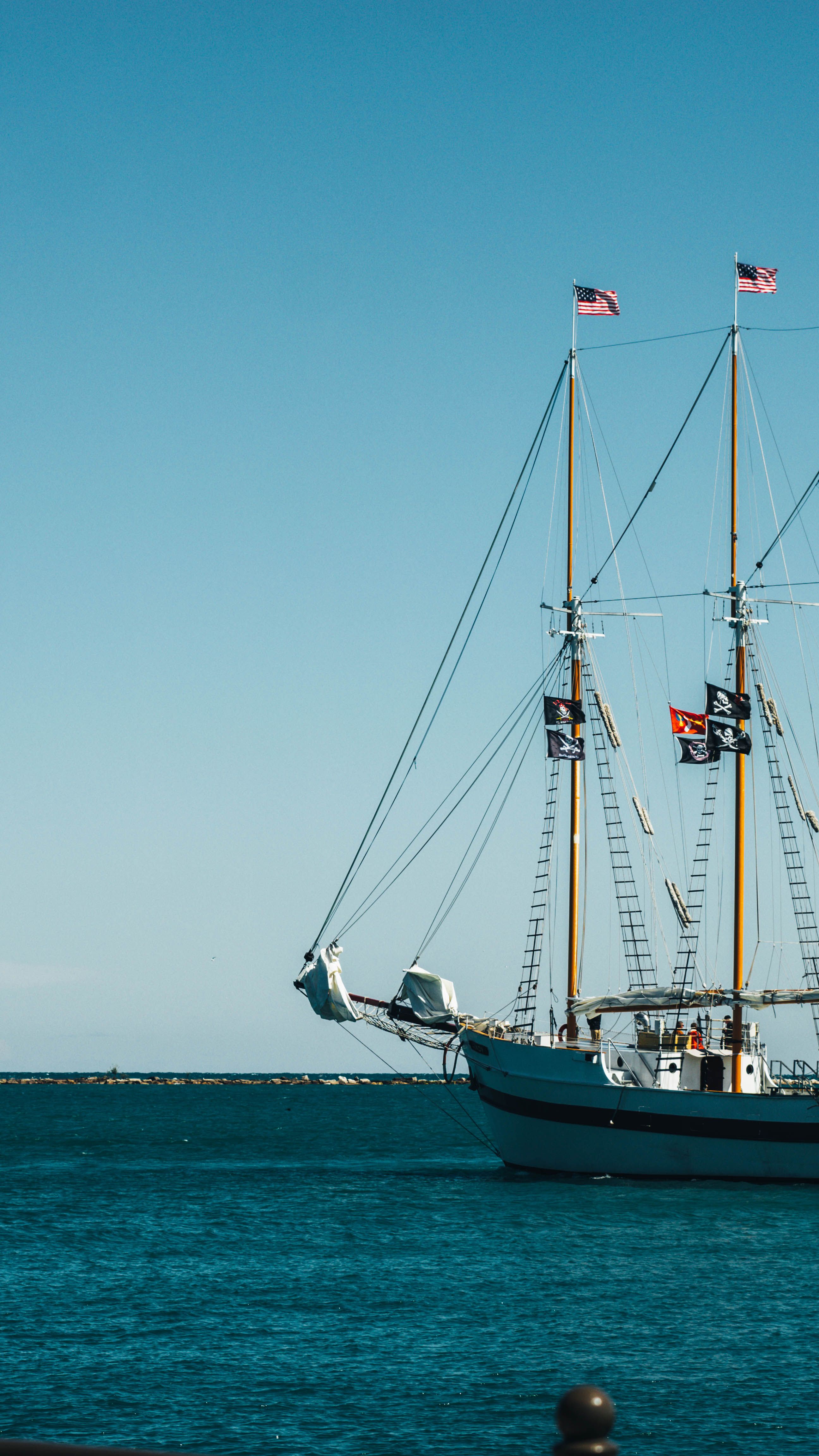 Ship with Flags of USA and Pirates on Sea · Free Stock Photo