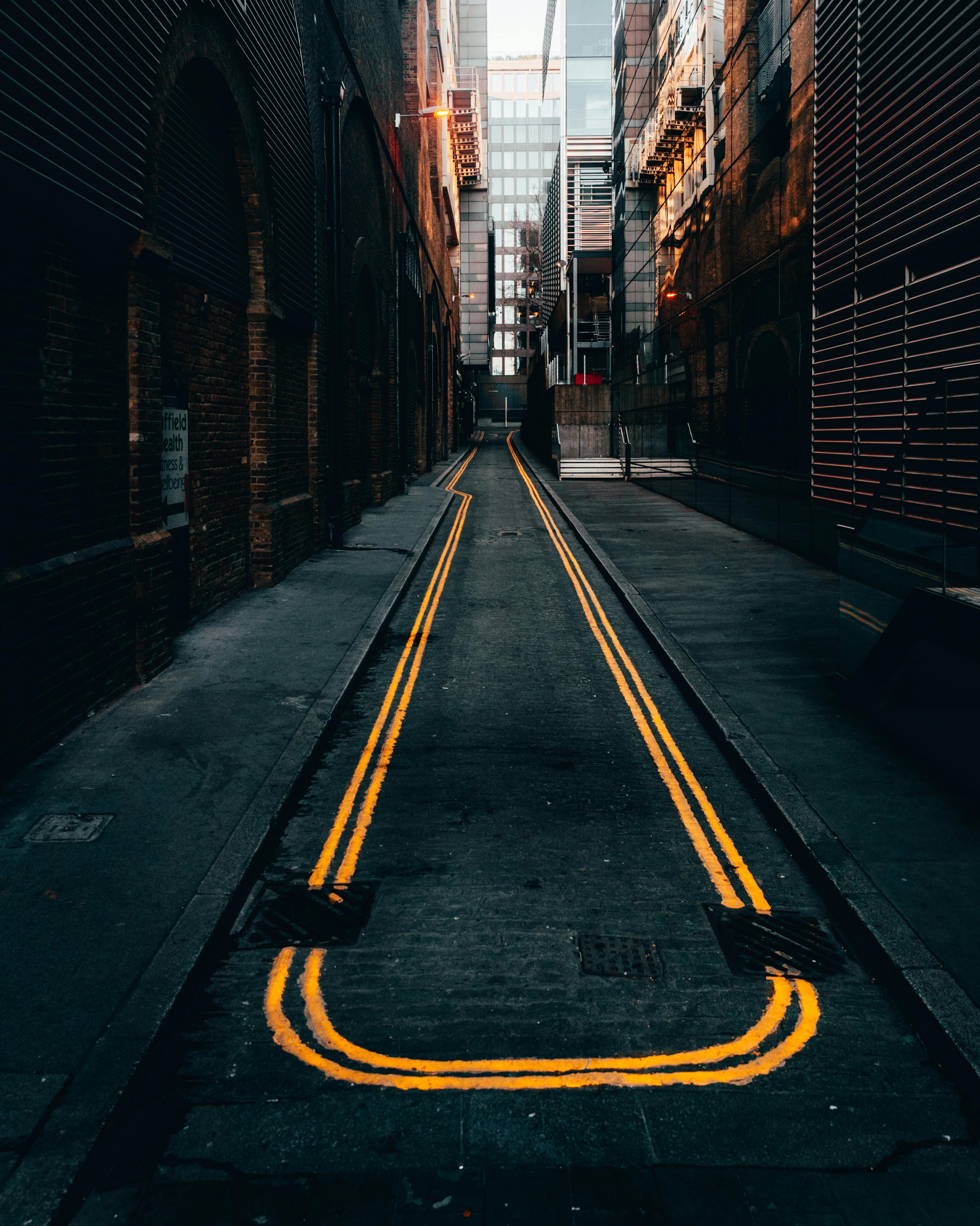 Photo of Empty Alley in Between Buildings · Free Stock Photo