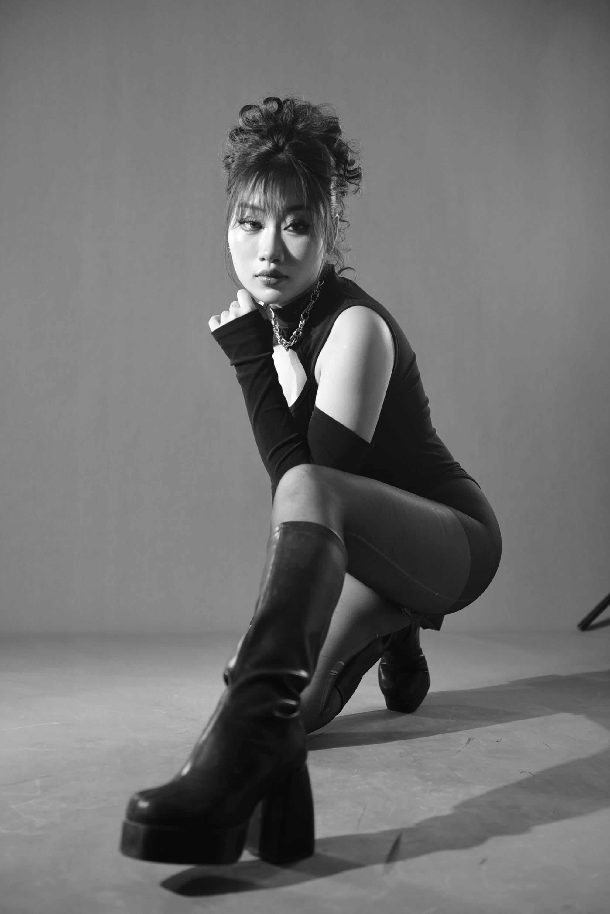 Woman Model Posing Crouching Wearing Black Blouse Stockings and Tall ...