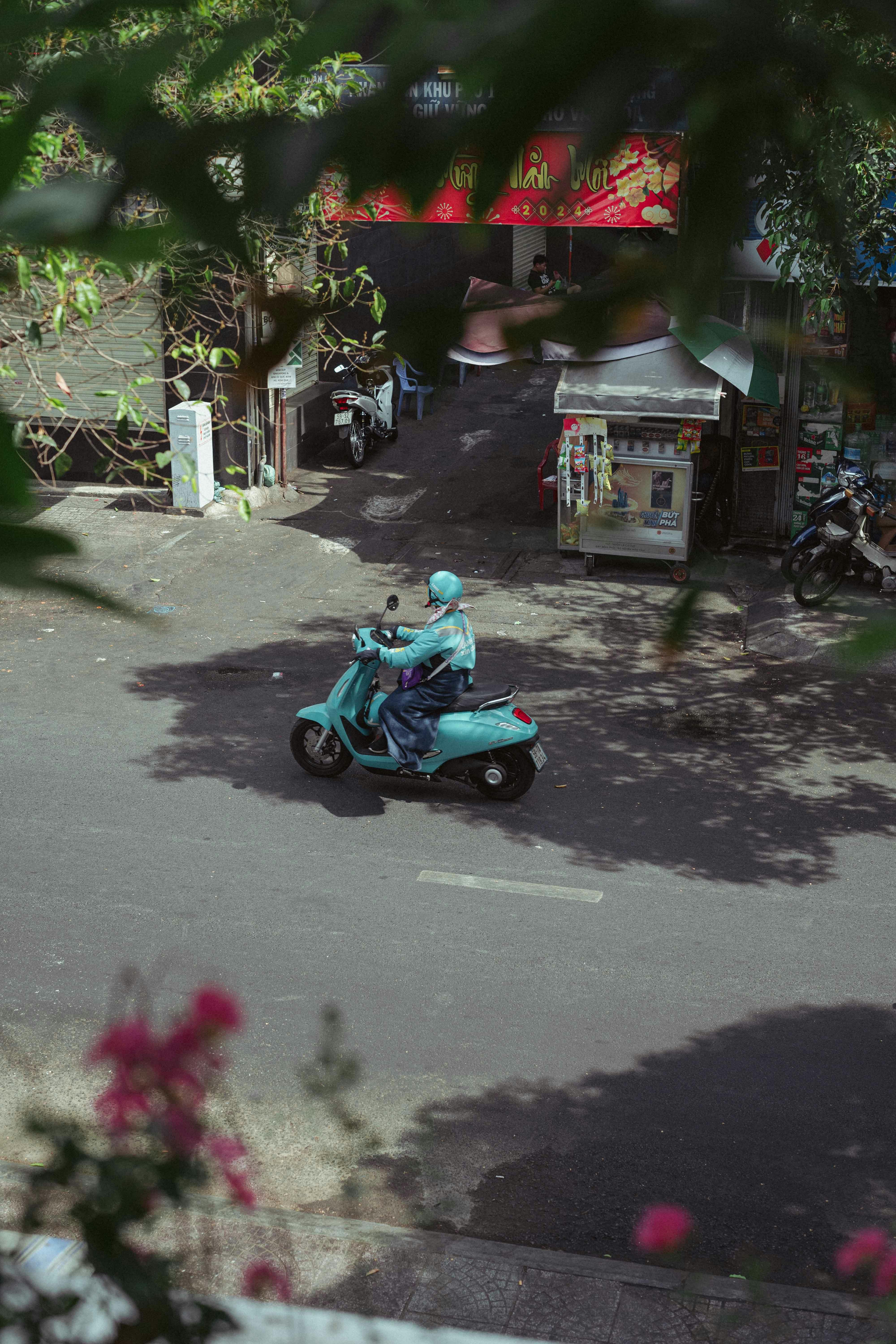 Person Riding Scooter in City · Free Stock Photo