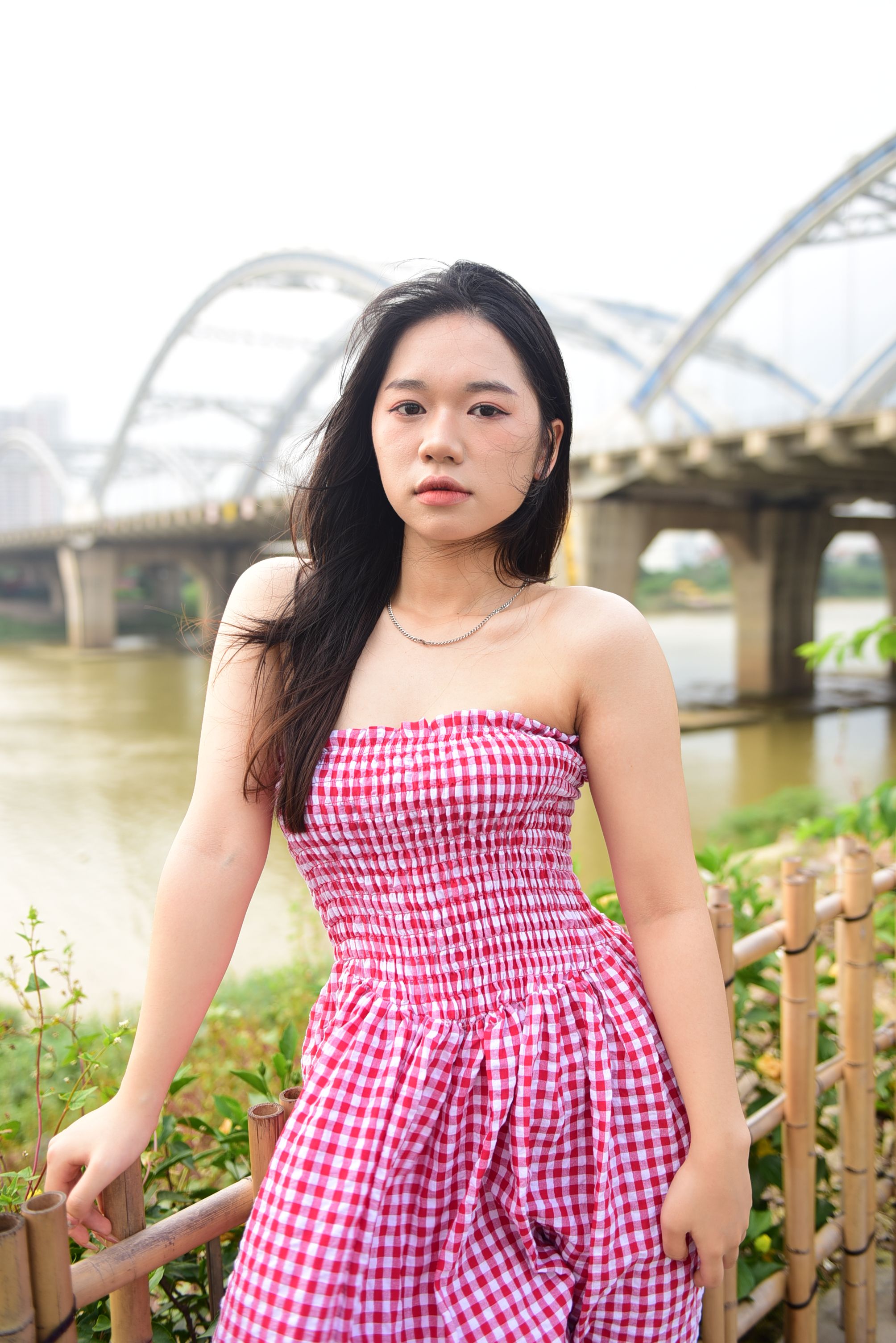 Brunette in Strapless Dress Posing by River · Free Stock Photo