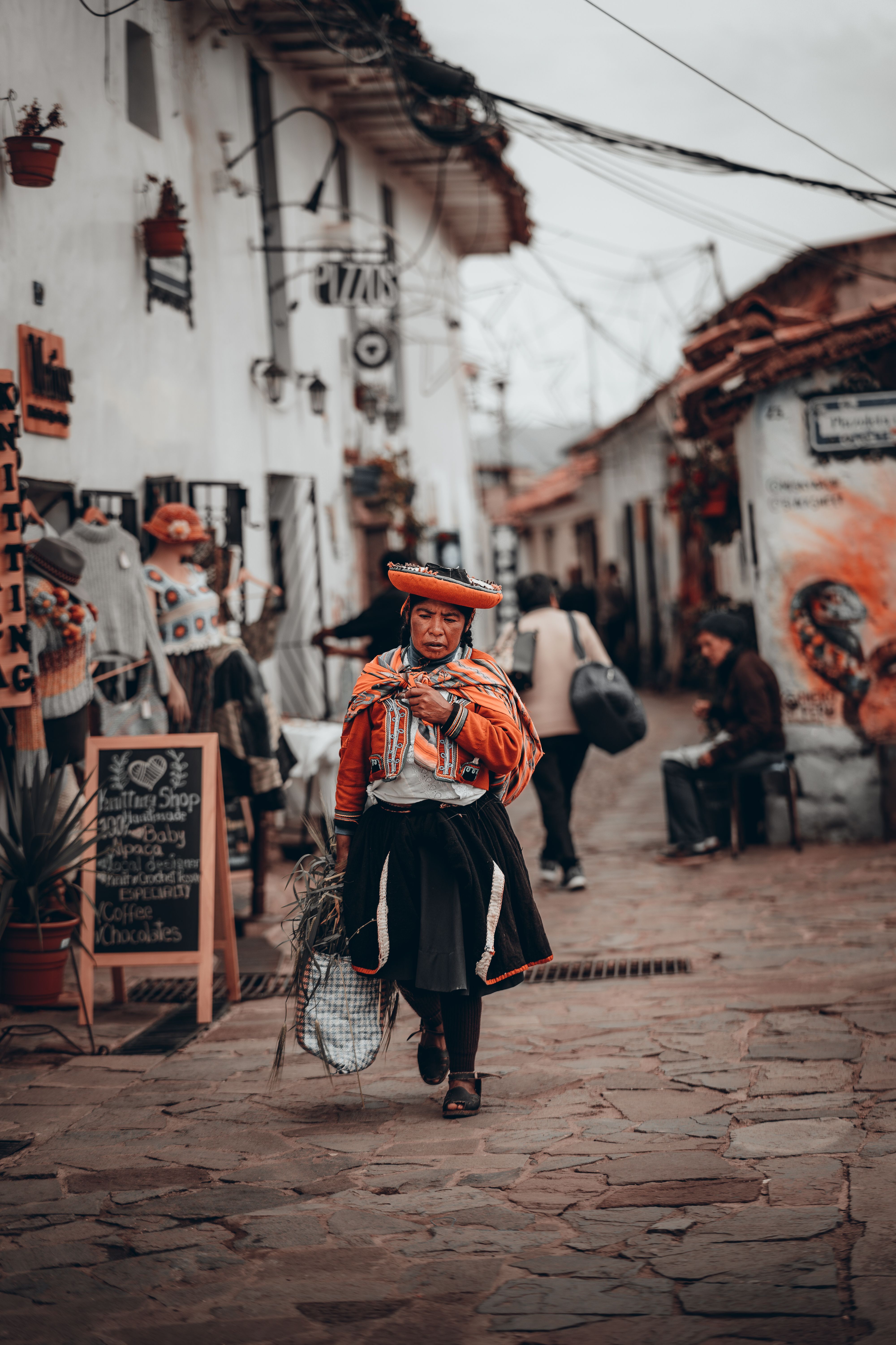 Woman Walking on Street in Traditional Clothing · Free Stock Photo