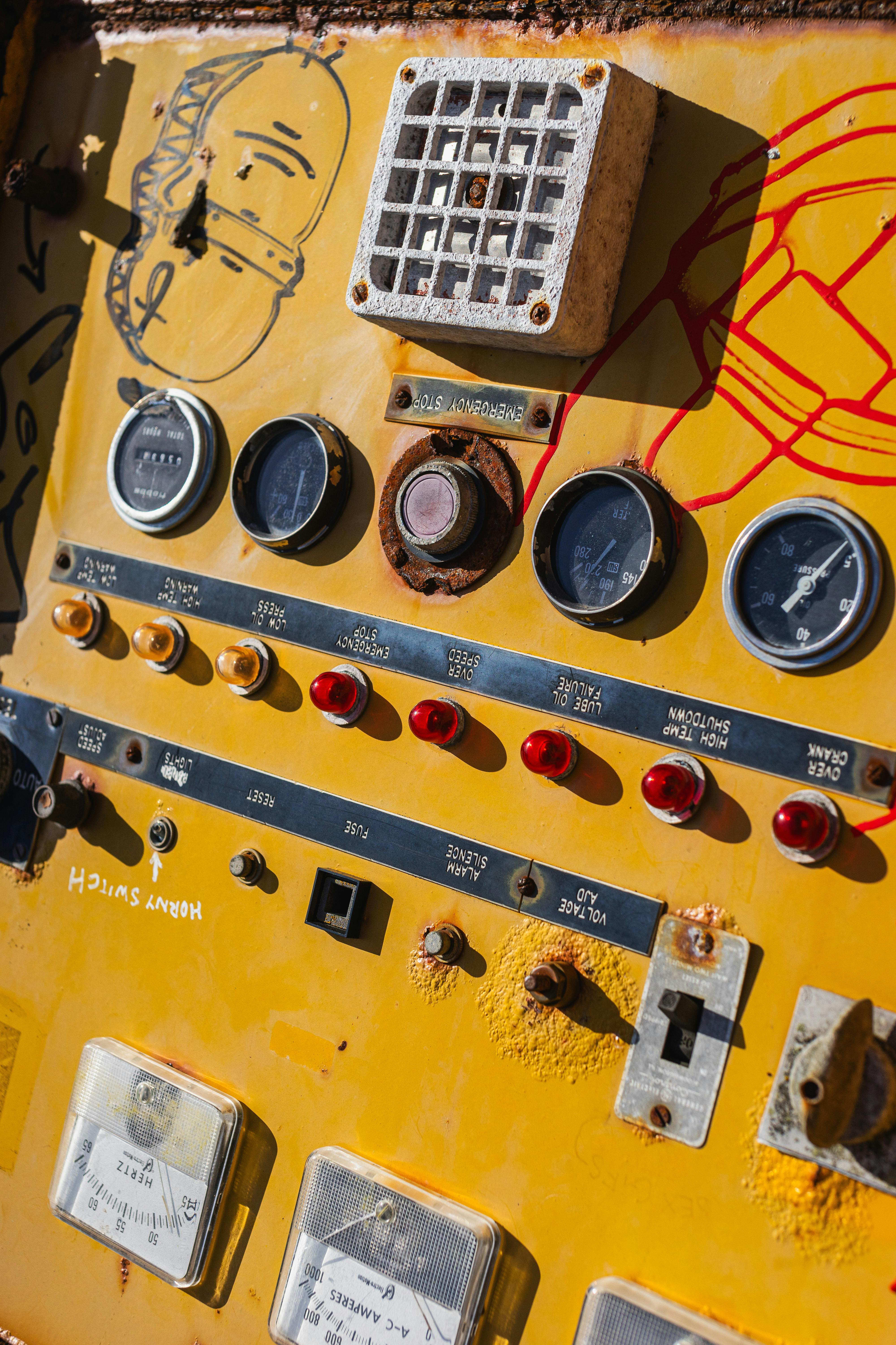 A close up of a yellow control panel · Free Stock Photo