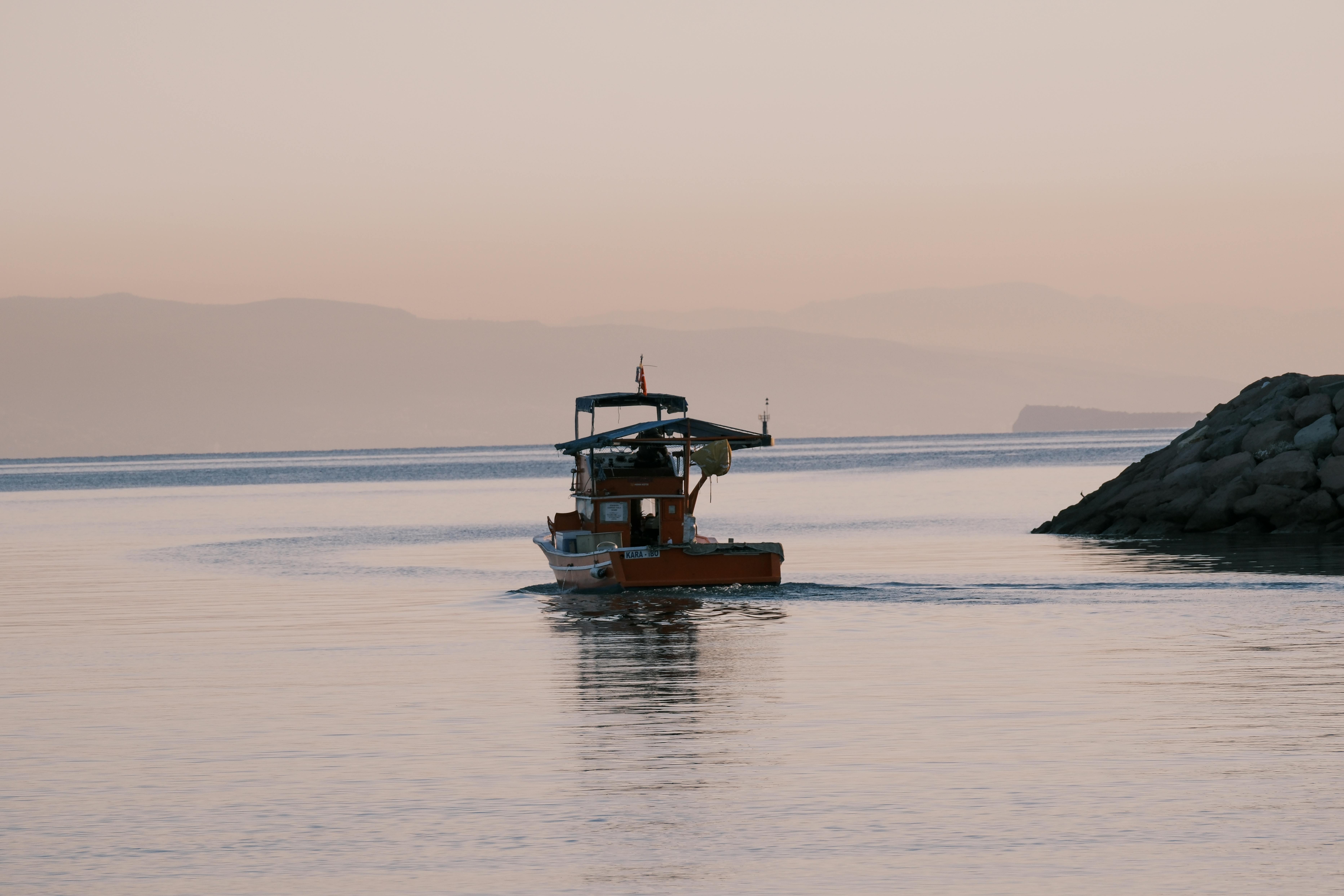Back View of Motorboat on Sea Coast · Free Stock Photo