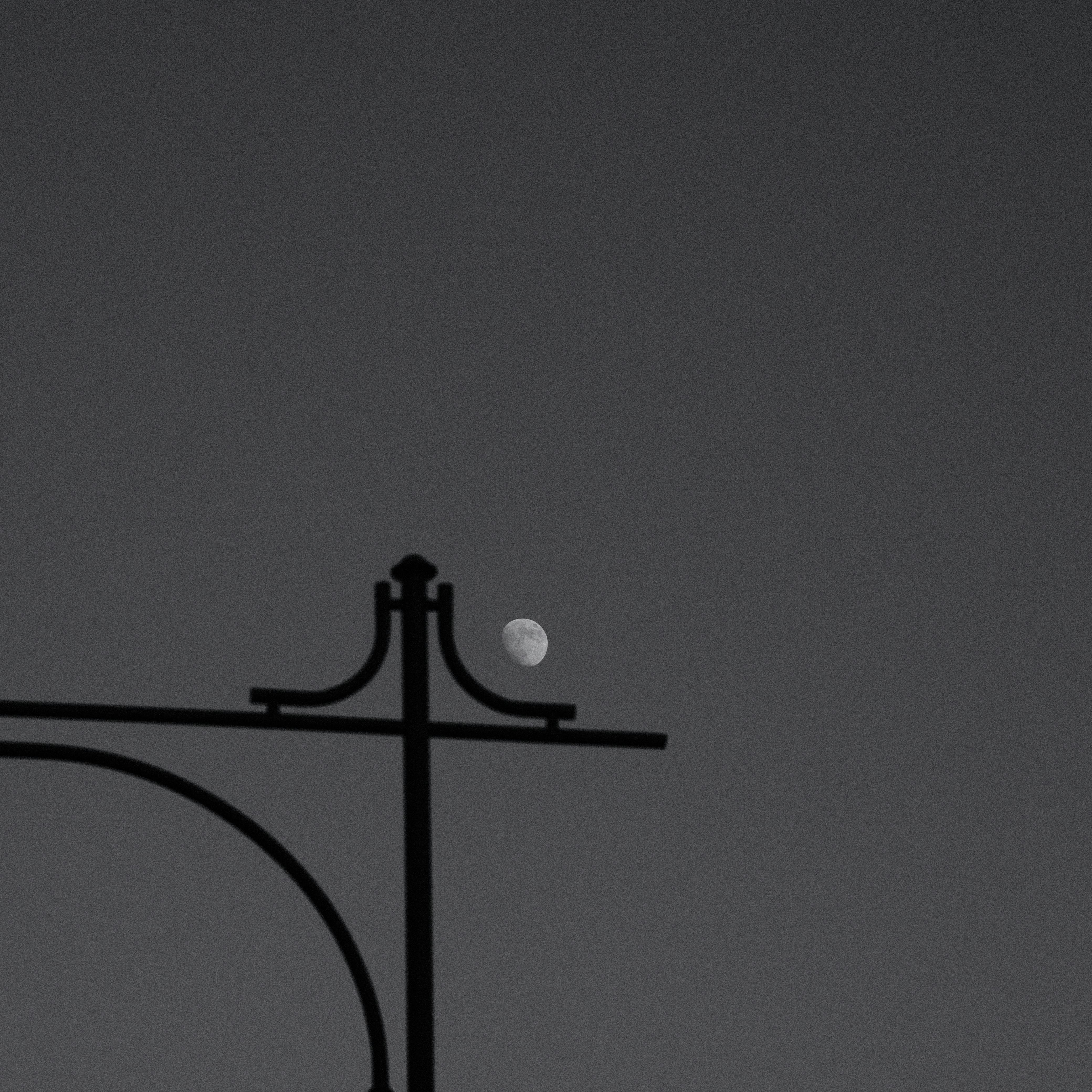 Moon behind Bars in Black and White · Free Stock Photo