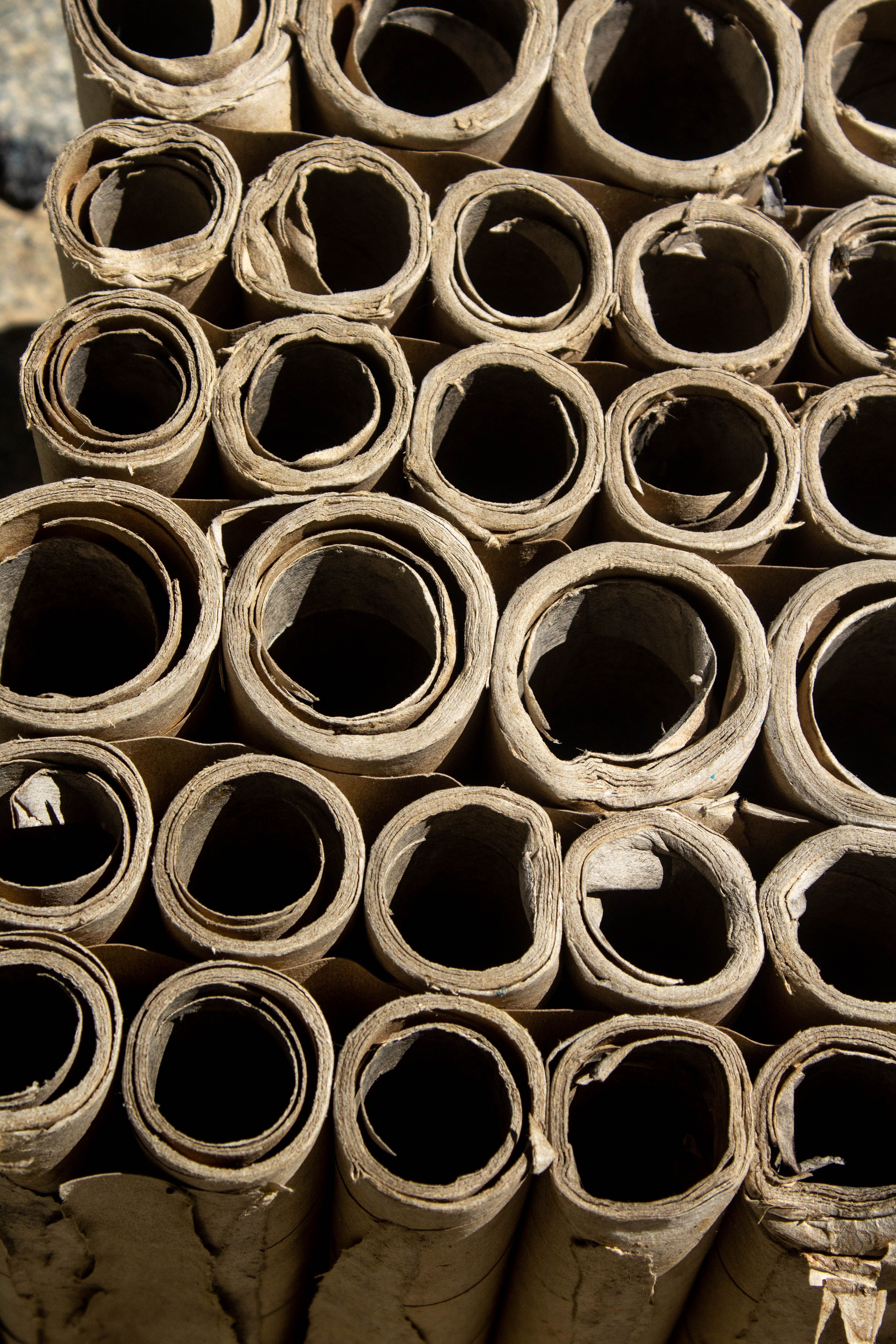 A pile of old brown paper rolls · Free Stock Photo