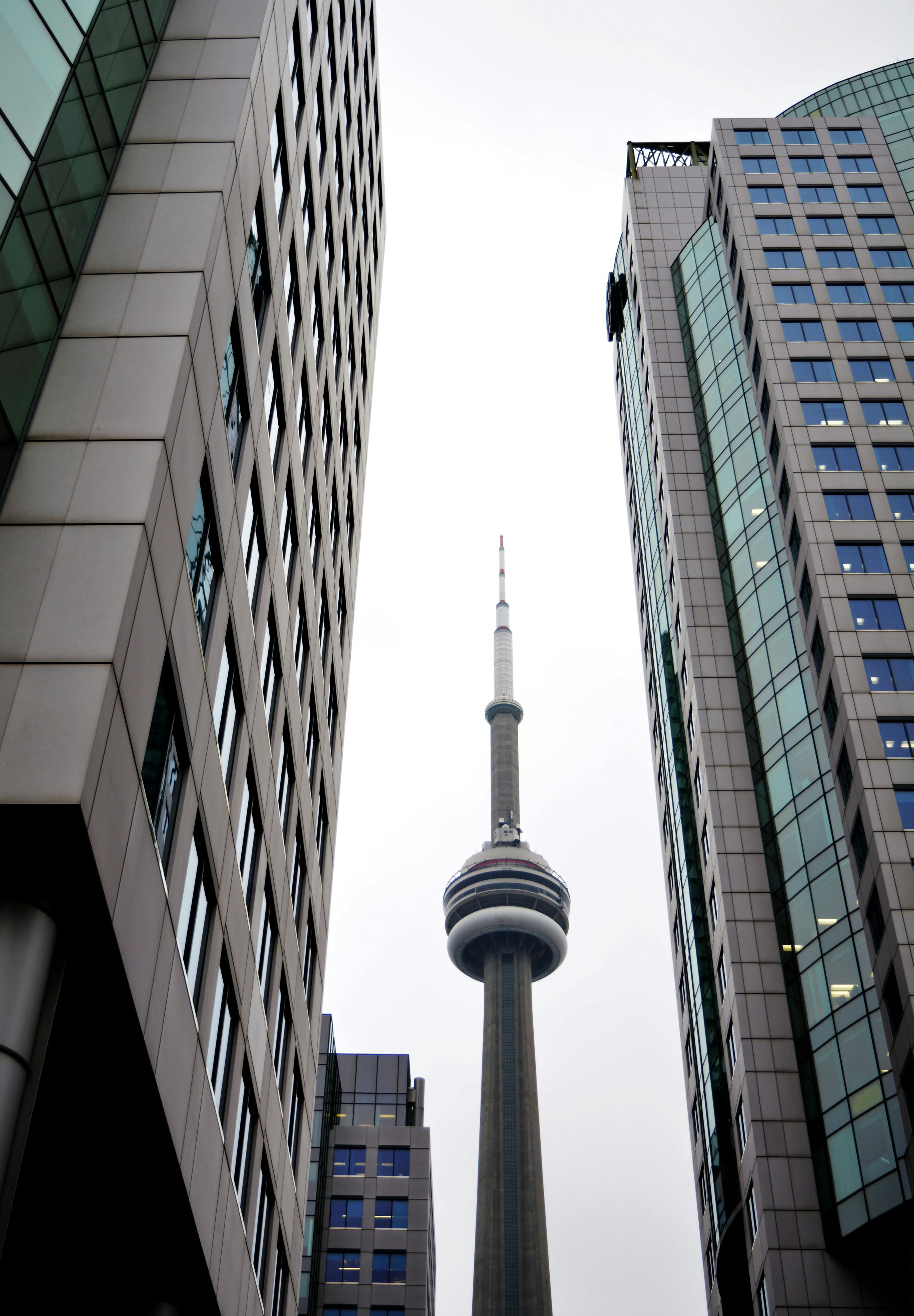Low Angle Photo of Tower Near Buildings · Free Stock Photo