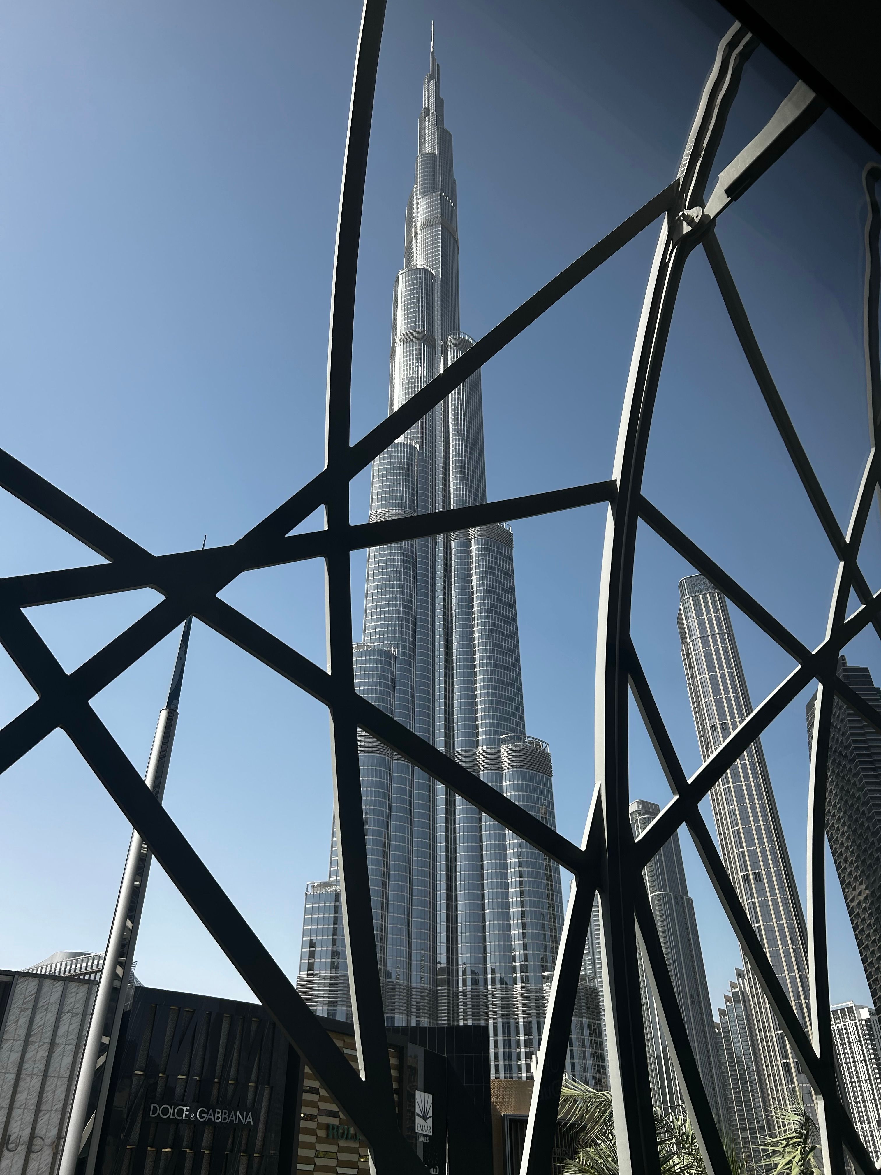 Burj Khalifa behind Windows · Free Stock Photo