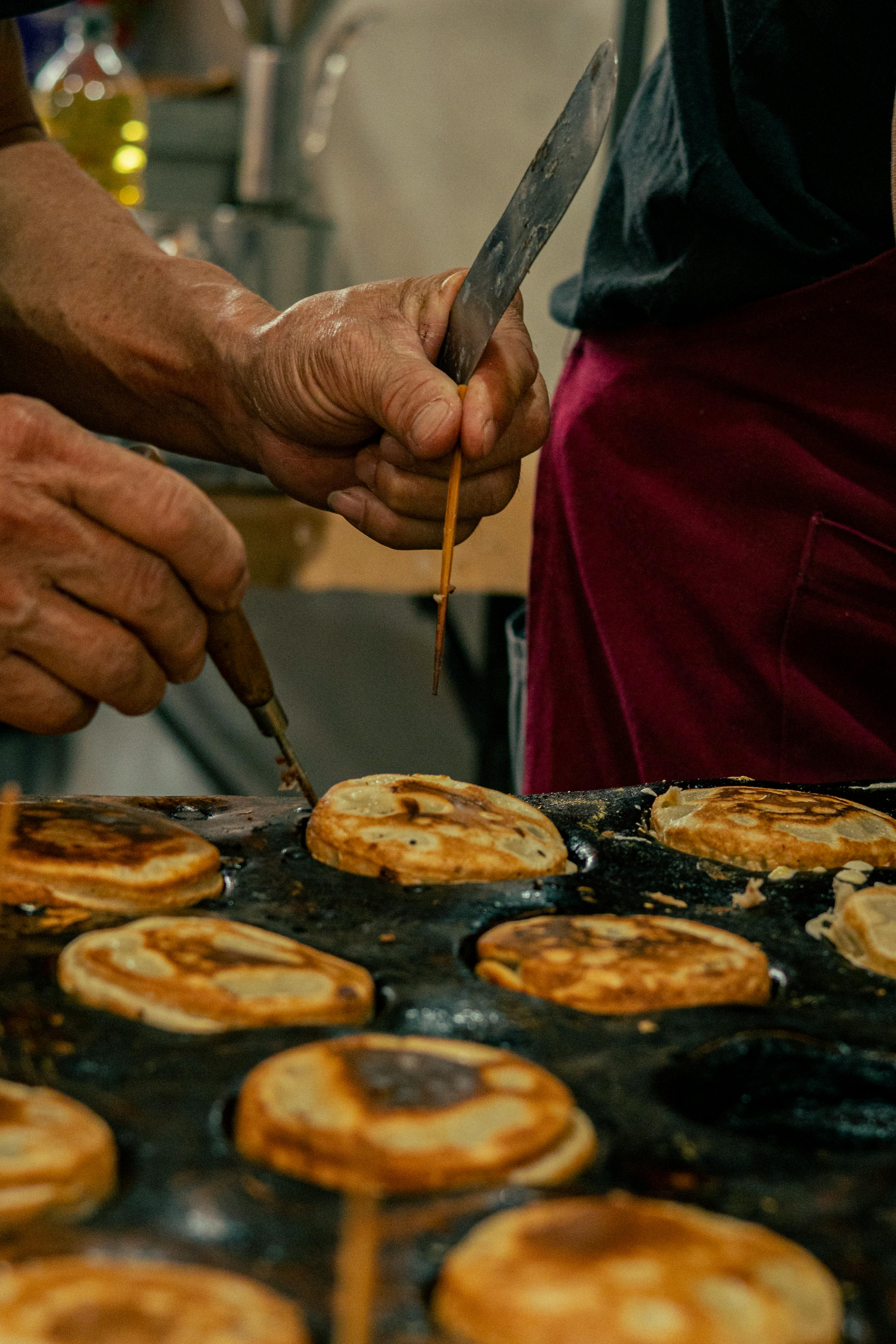 Hands of Person Preparing Food and Holding Hatchet over Stove · Free ...
