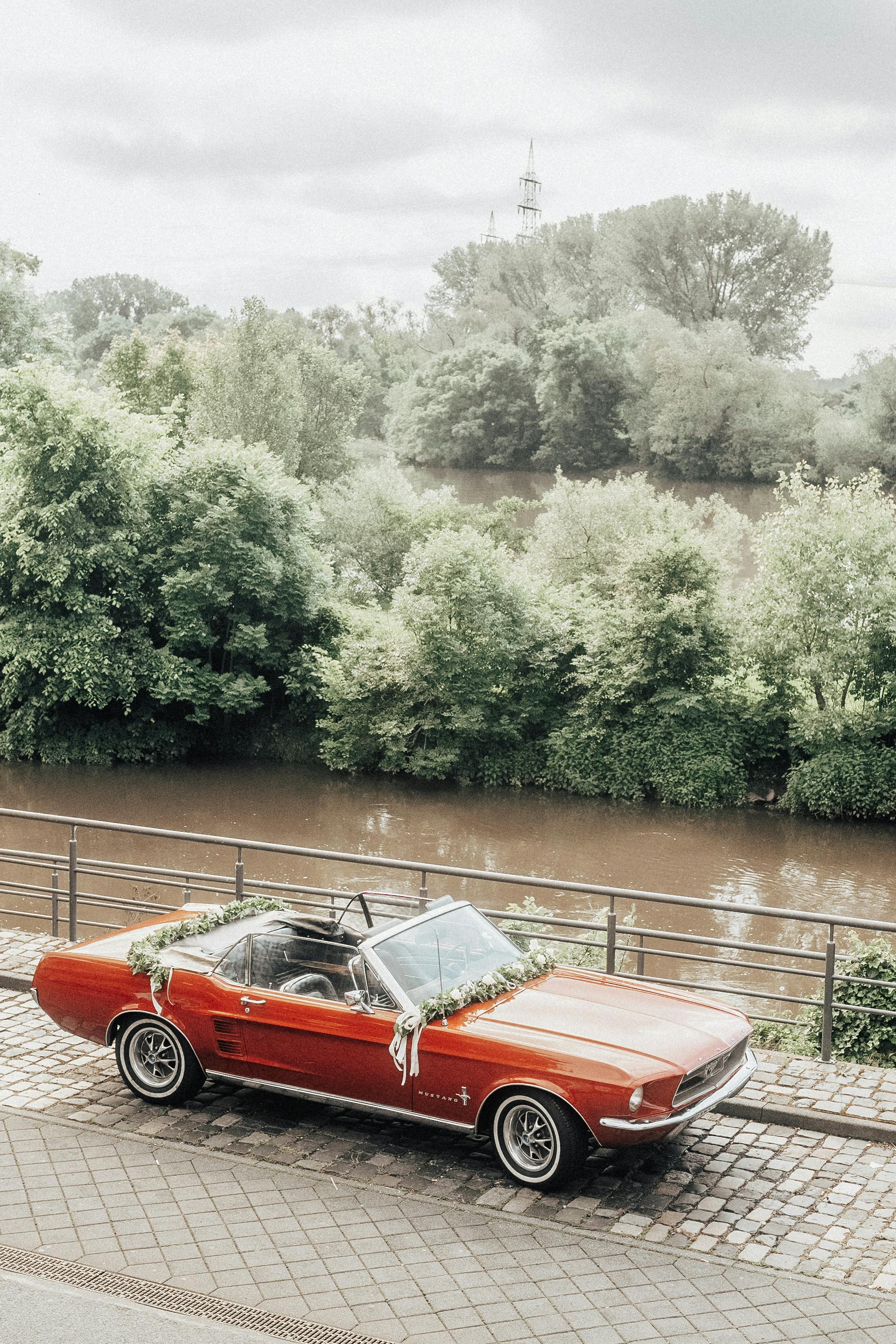 Classic Ford Mustang with Wedding Decorations Parked by the River ...