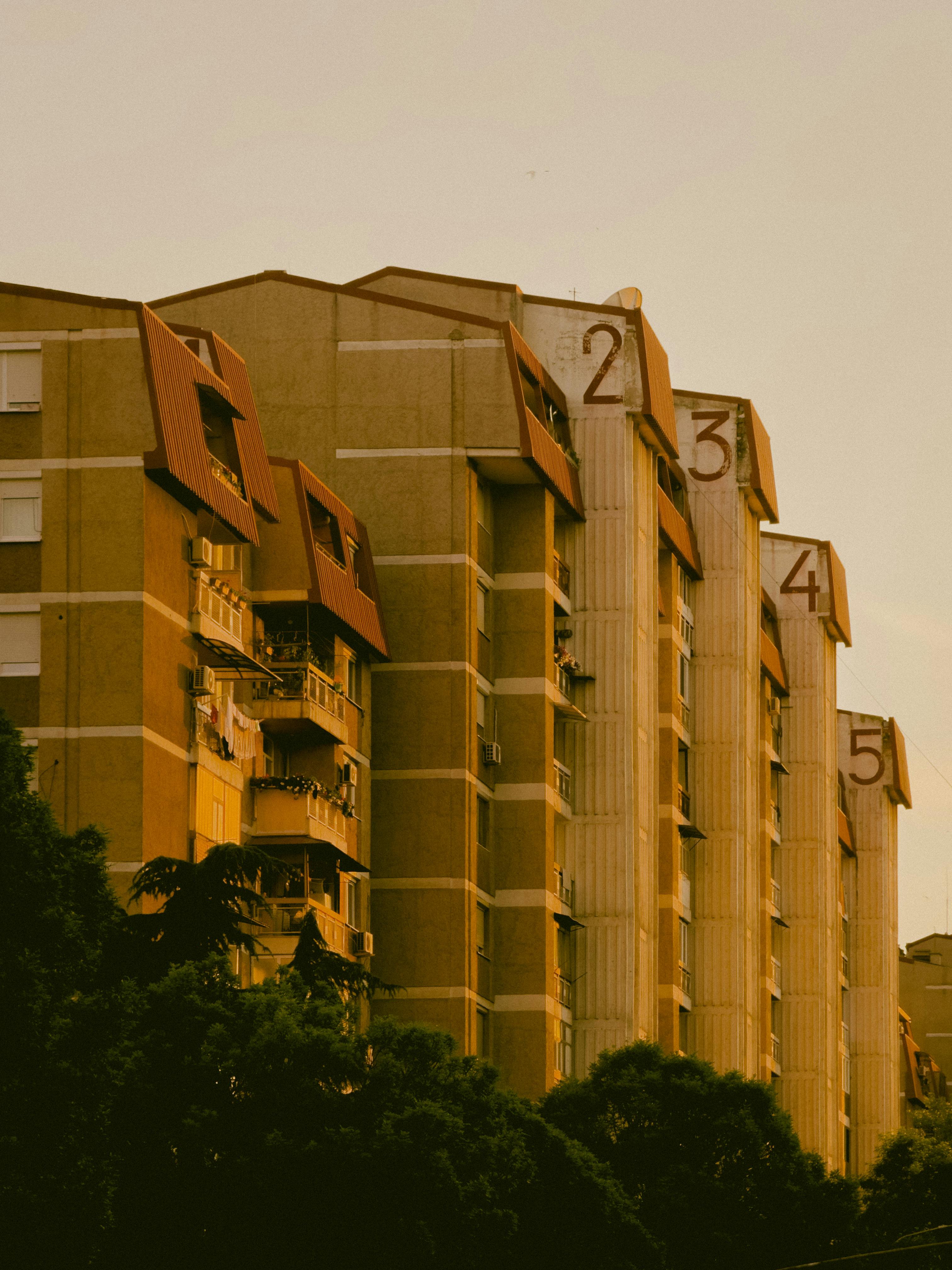 A tall building with numbers on it · Free Stock Photo