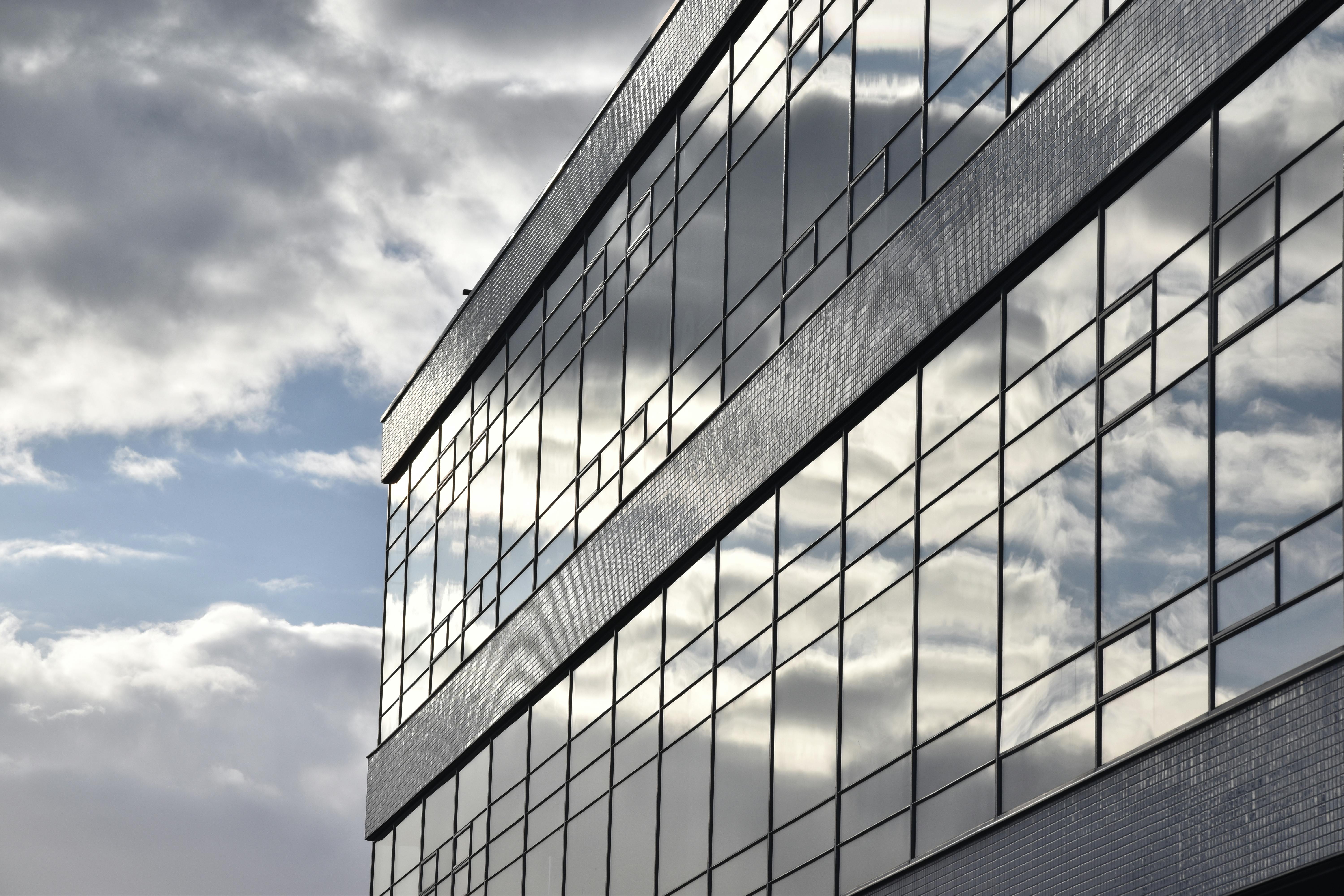 Clouds Reflection in Office Building Windows · Free Stock Photo